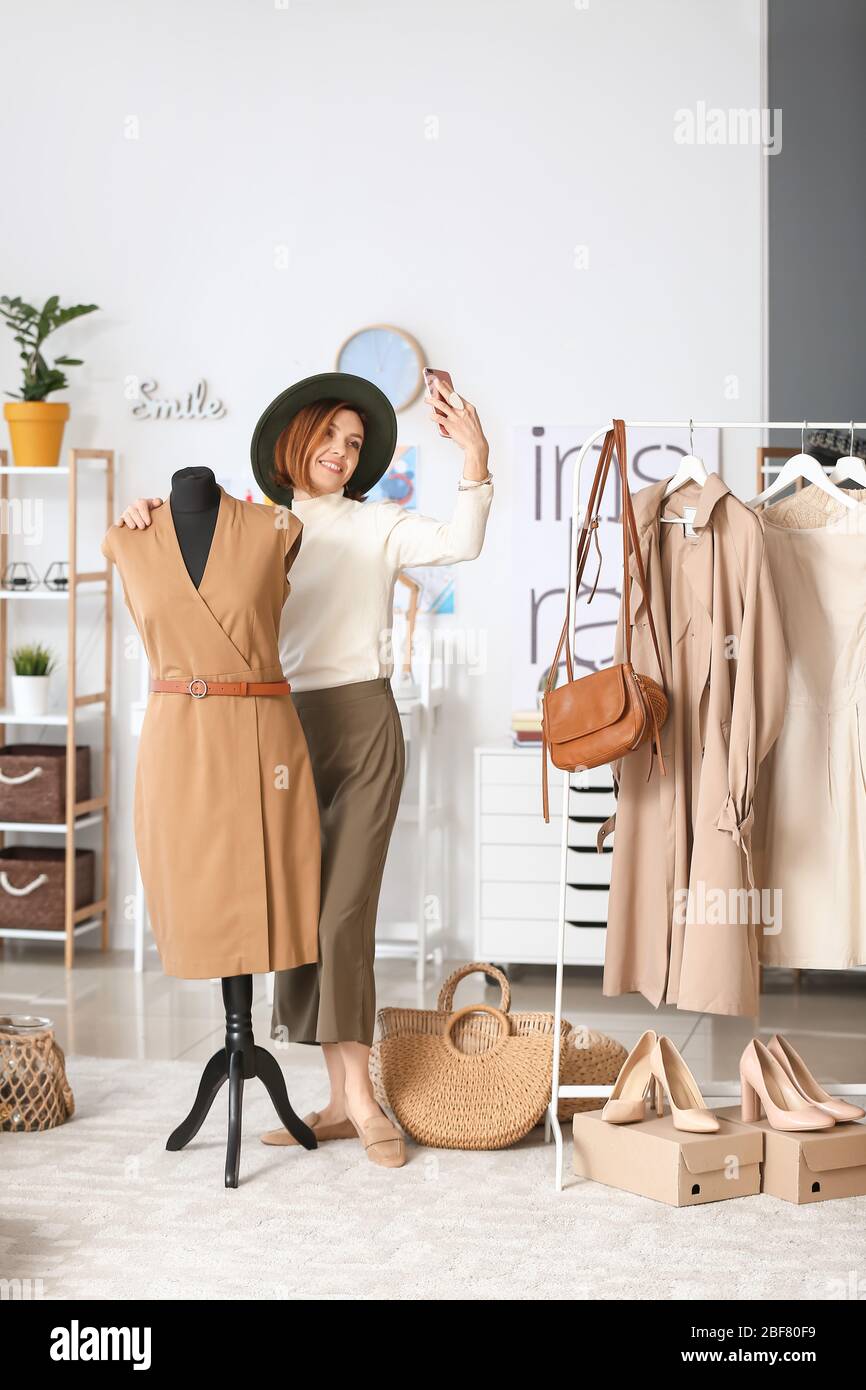 Female stylist recording video in her studio Stock Photo - Alamy