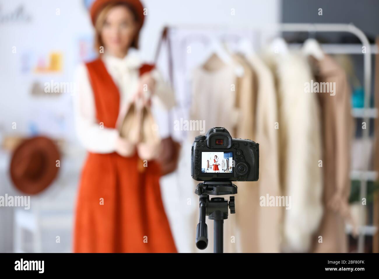 Female stylist recording video in her studio Stock Photo - Alamy