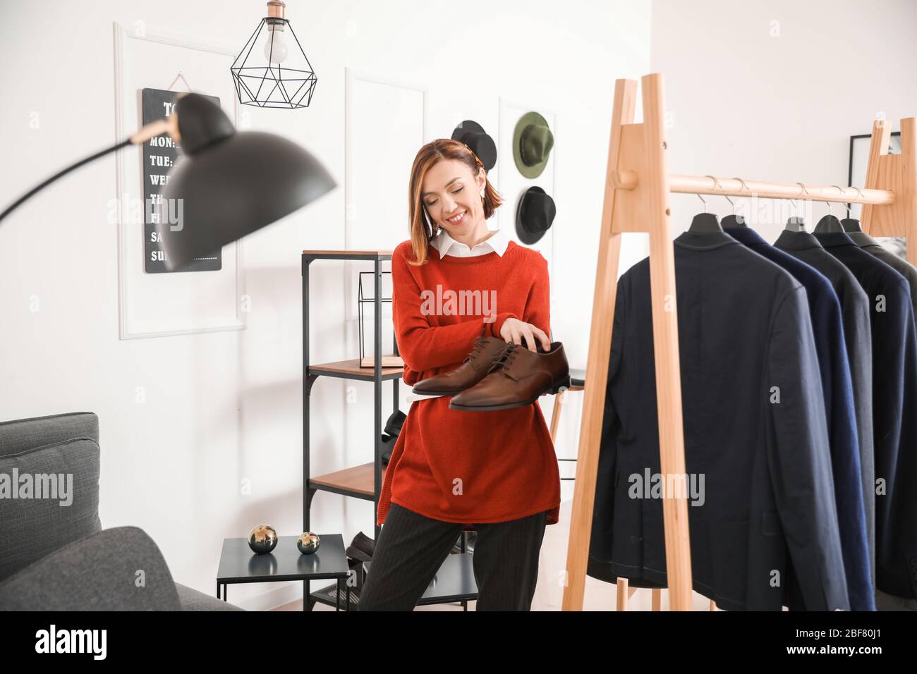 Female stylist with shoes in her studio Stock Photo - Alamy