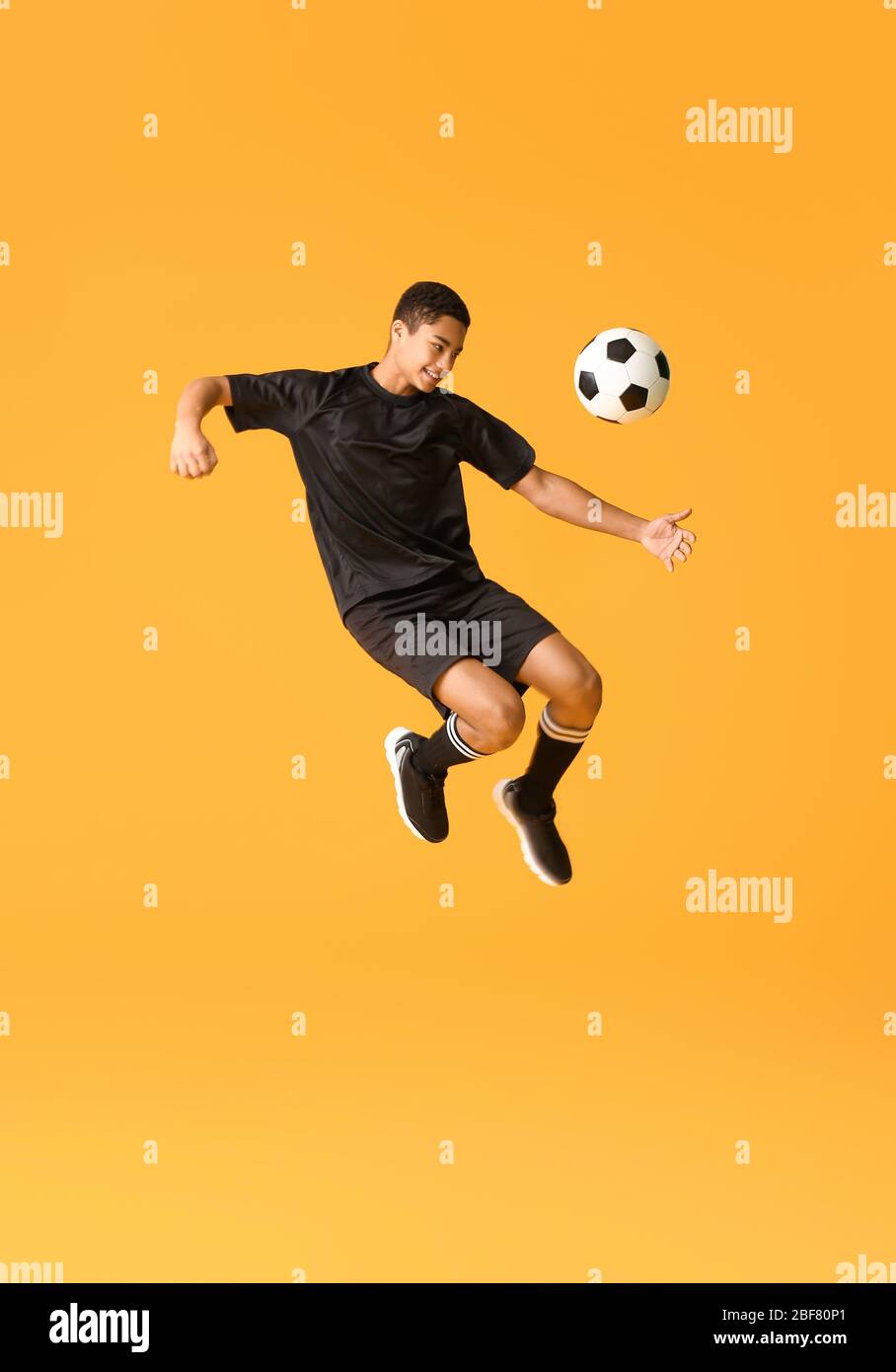 Young African-American football player on color background Stock Photo ...