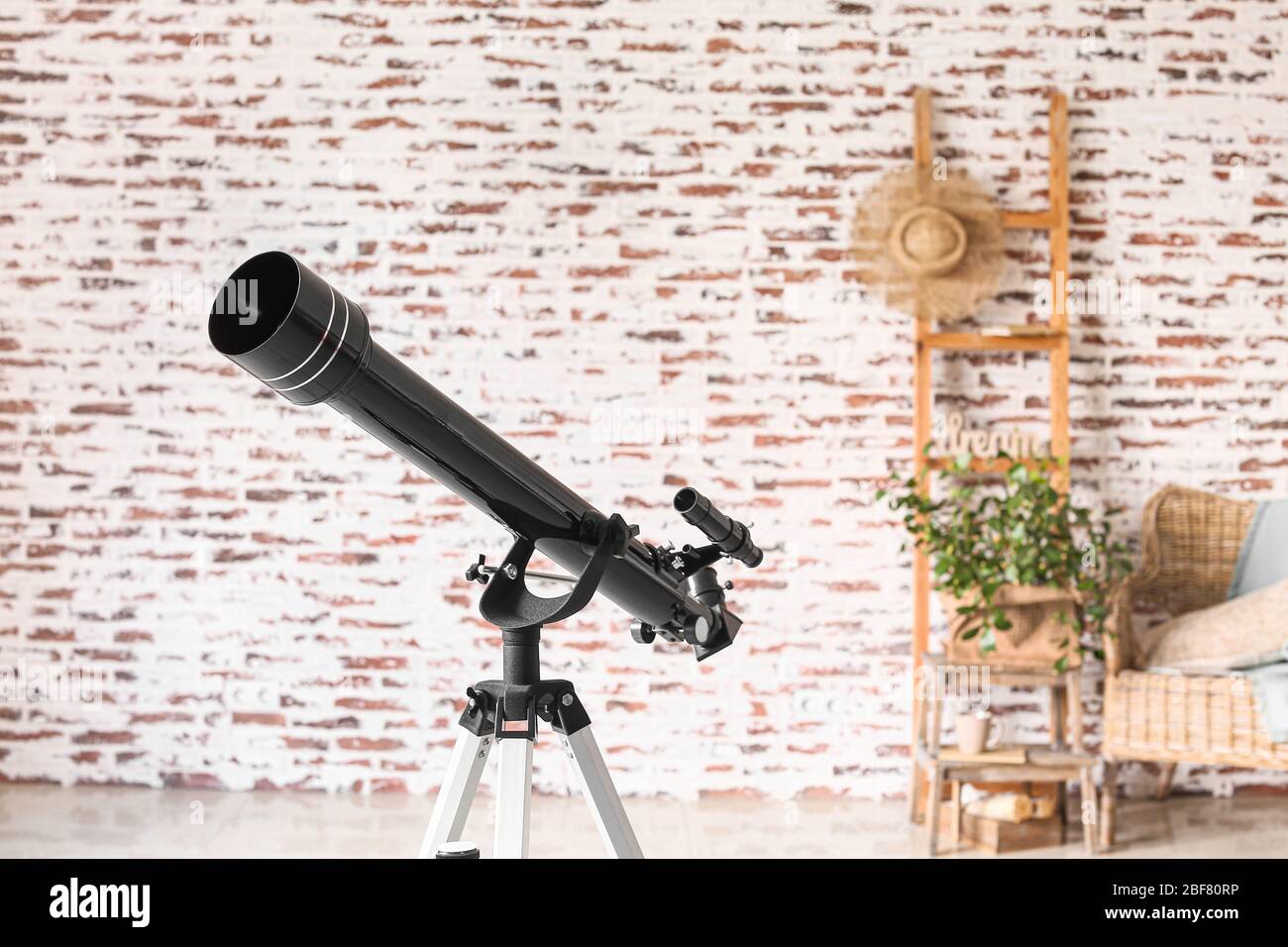 Modern telescope in interior of room Stock Photo - Alamy