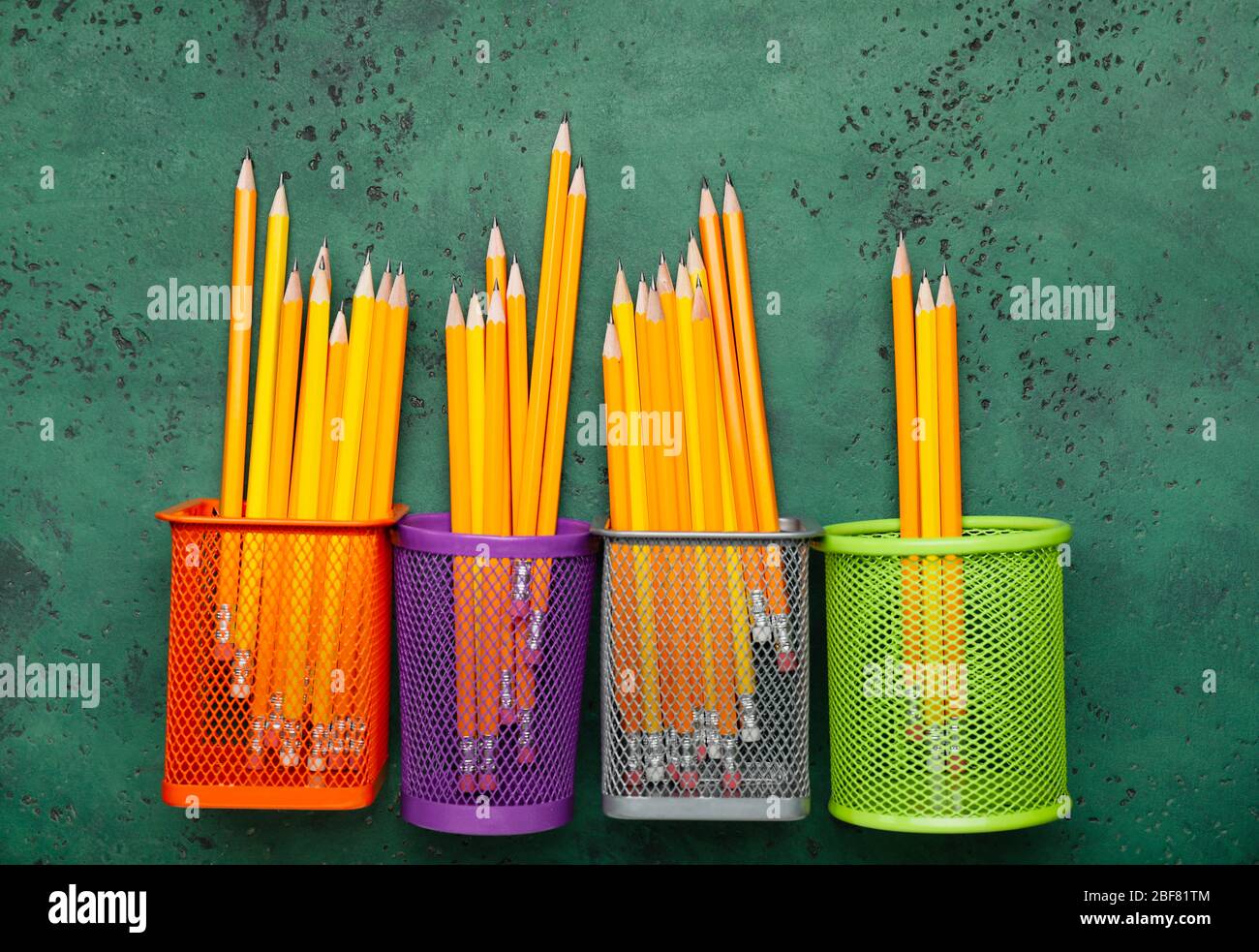 Ordinary pencils on color background Stock Photo - Alamy