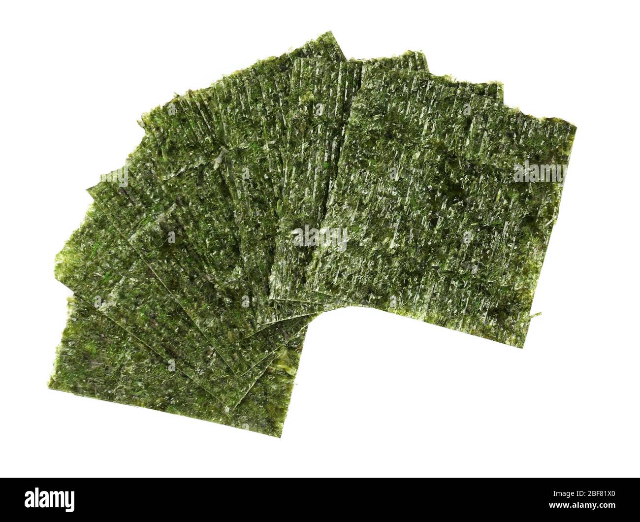 Tasty seaweed sheets on white background Stock Photo - Alamy