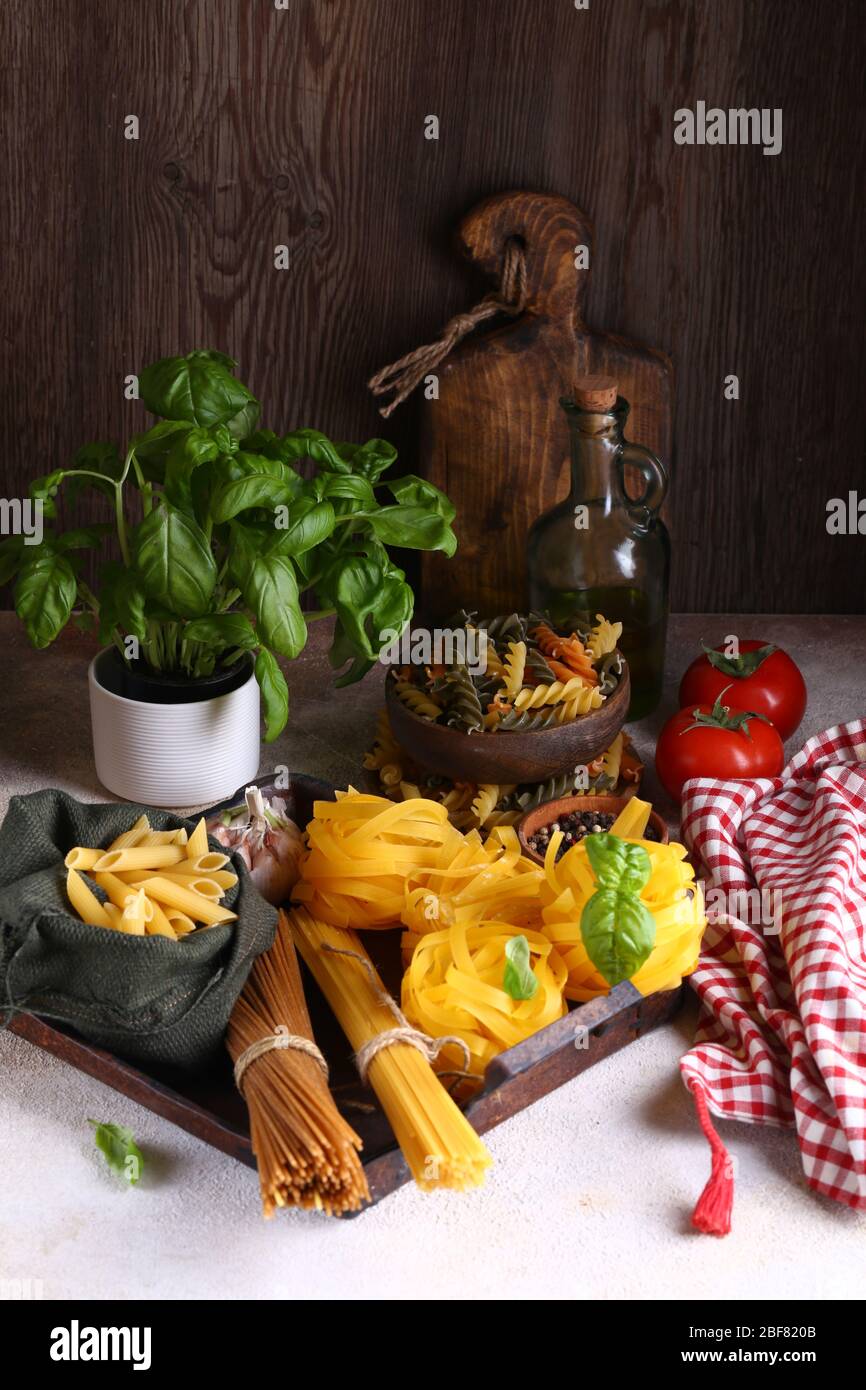 still life italian food pasta tomatoes garlic basil and olive oil Stock ...