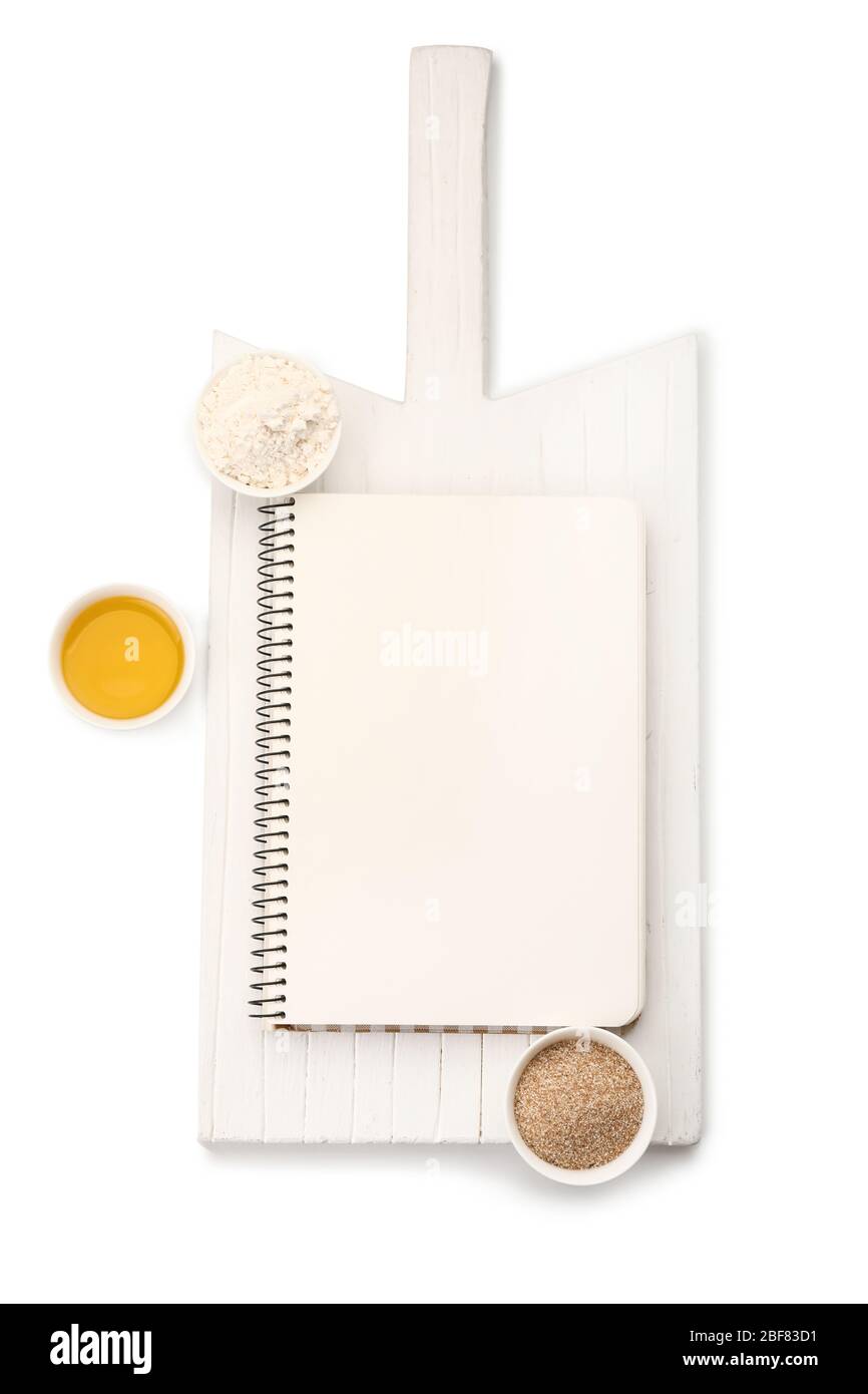 Cook book with products on white background Stock Photo - Alamy