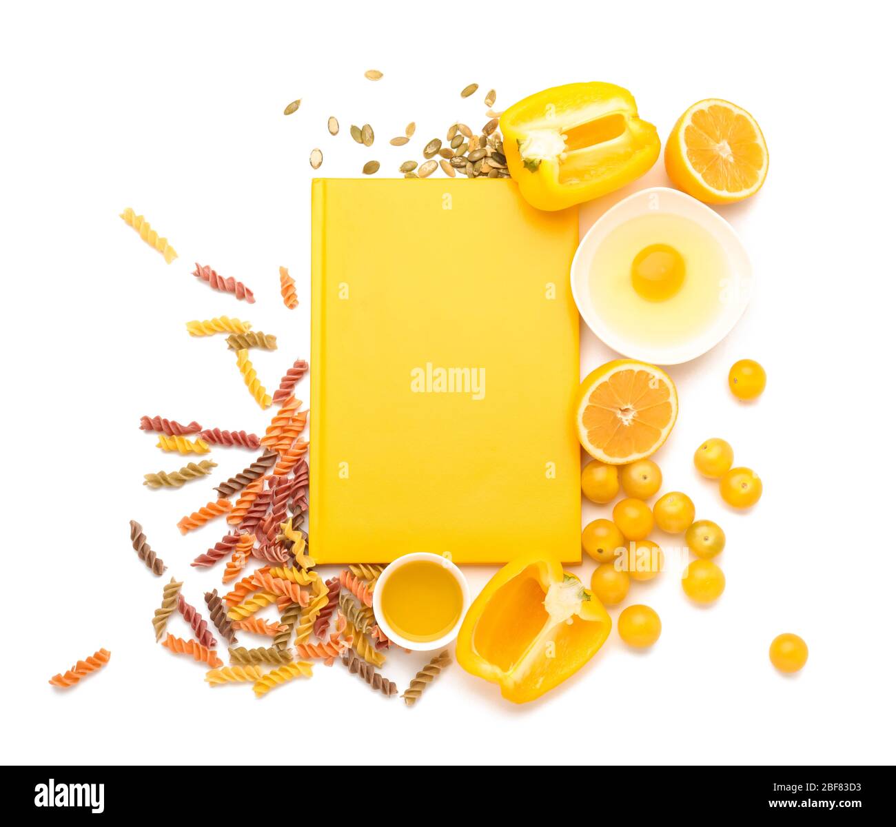 Cook book with products on white background Stock Photo - Alamy