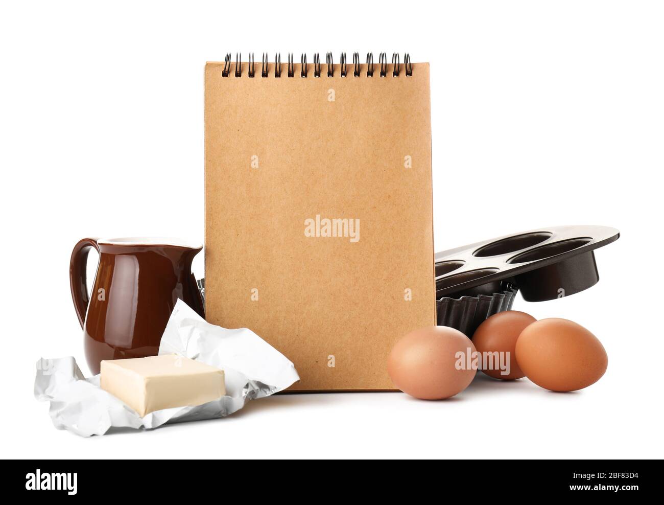 Cook book with products on white background Stock Photo - Alamy