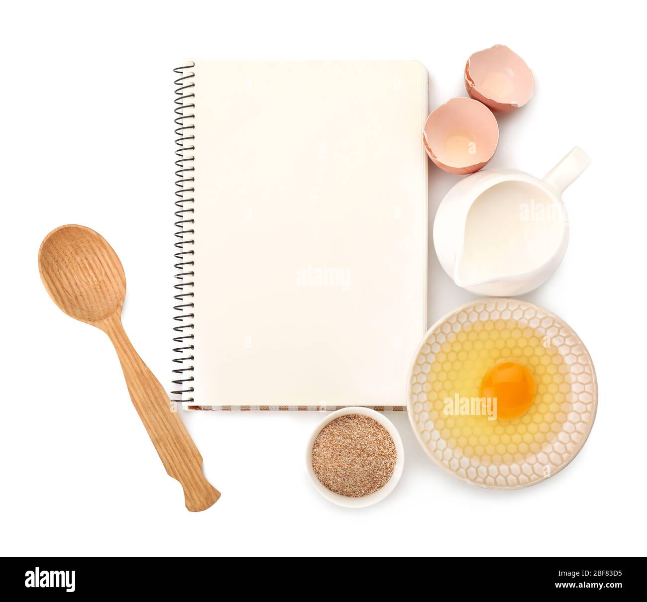 Cook book with products on white background Stock Photo - Alamy