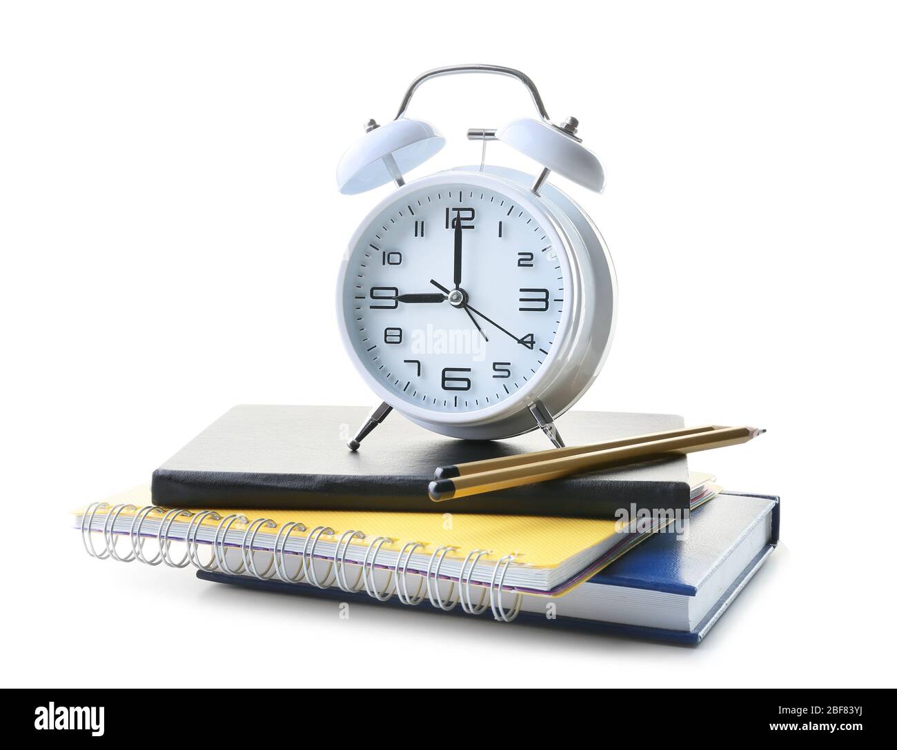 Set of school supplies and clock on white background. Time to study ...