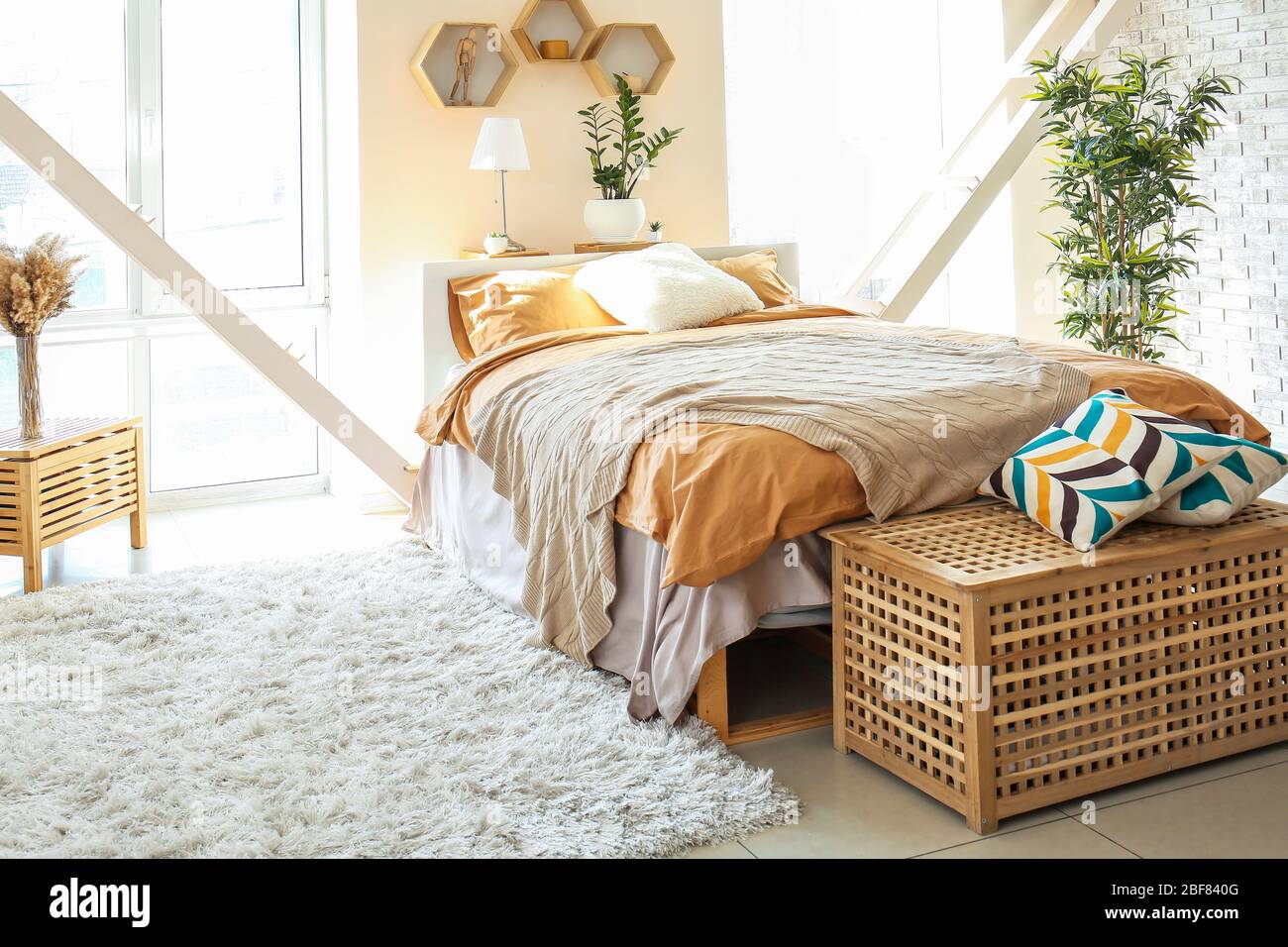 Interior of beautiful modern room with comfortable bed Stock Photo - Alamy