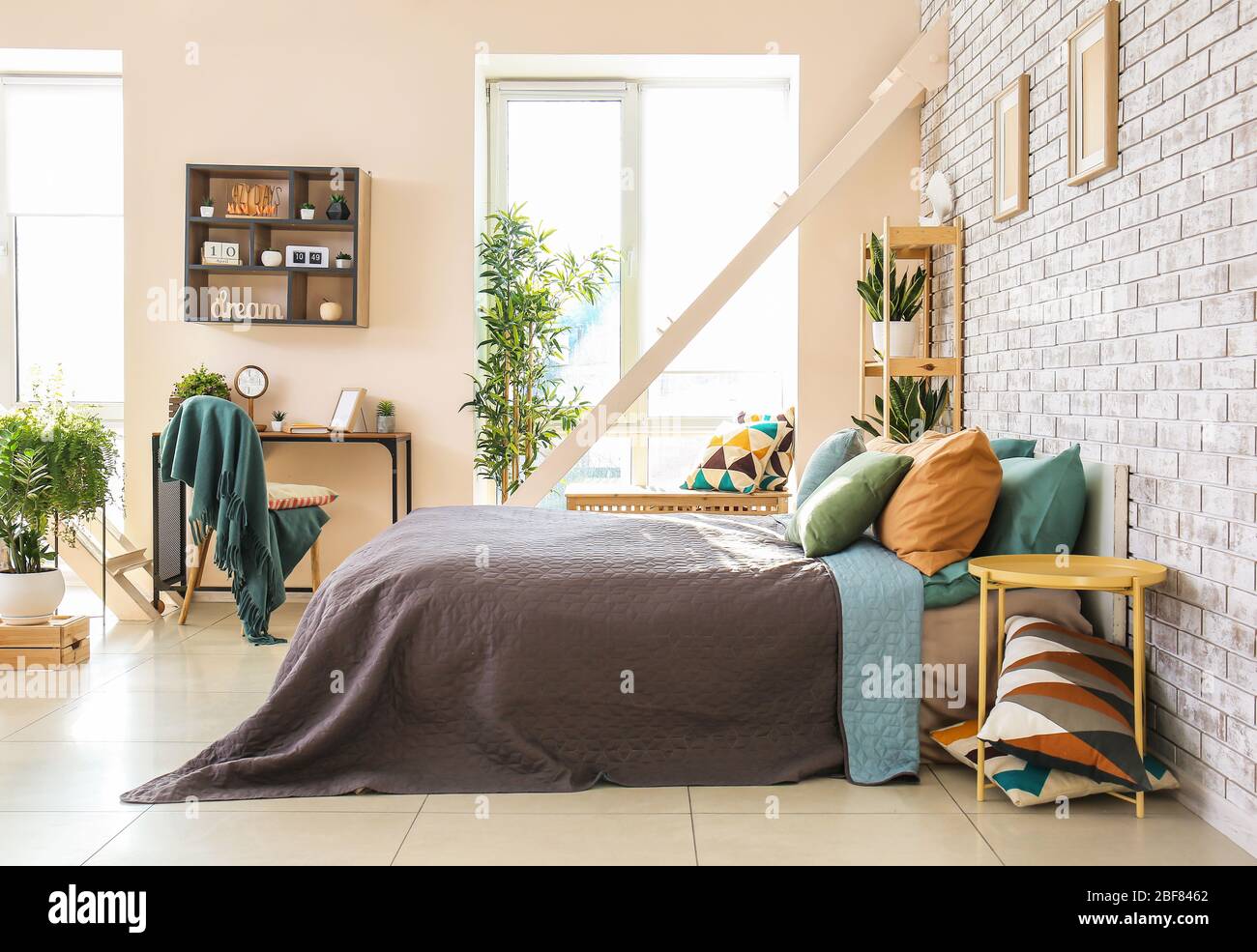 Interior of beautiful modern room with comfortable bed Stock Photo - Alamy