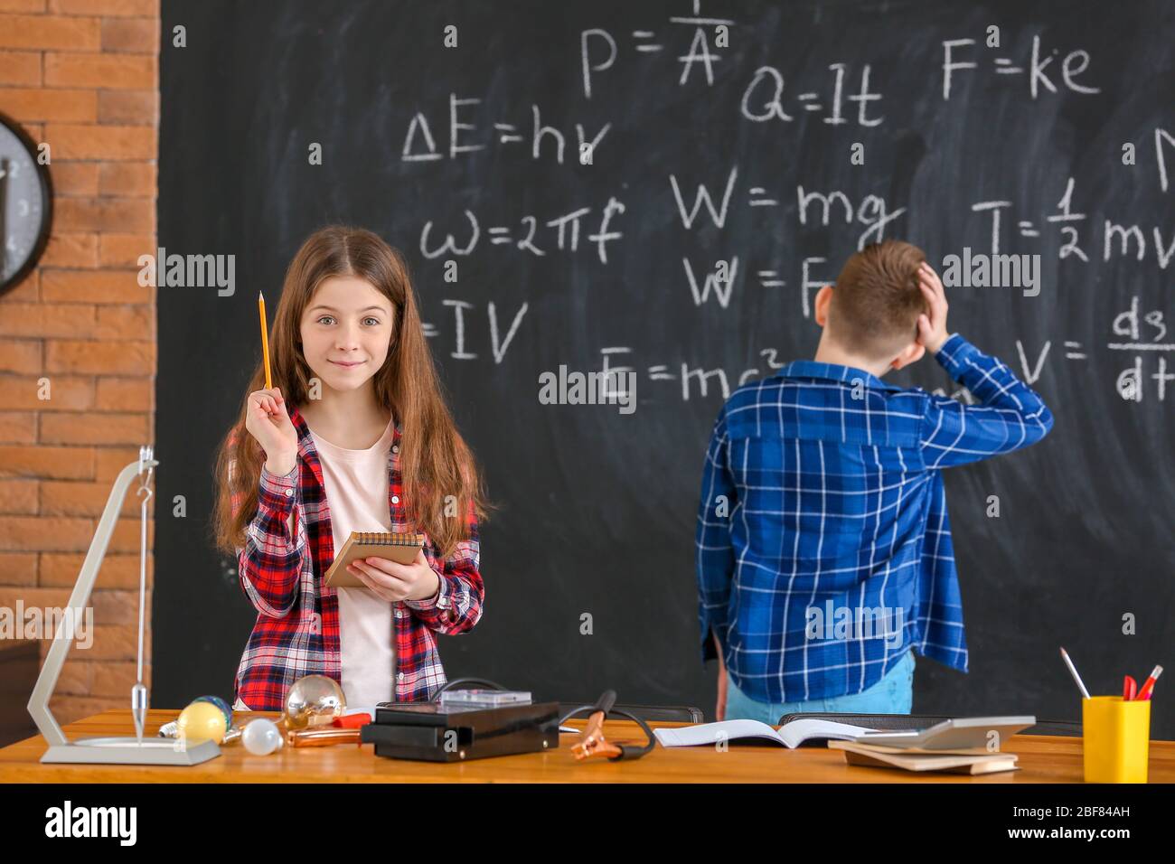 Cute little children at physics lesson in classroom Stock Photo - Alamy