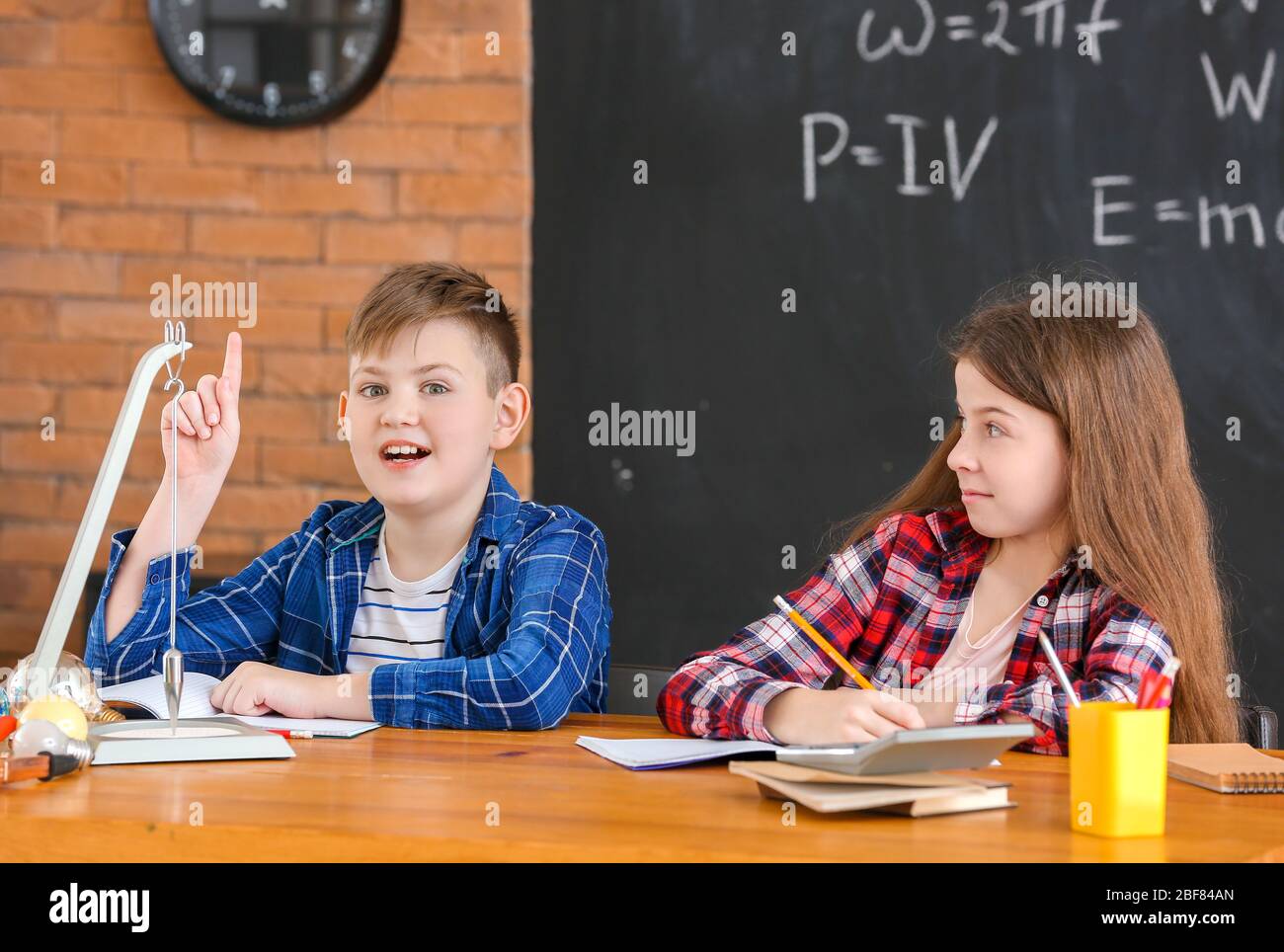Cute little children at physics lesson in classroom Stock Photo - Alamy
