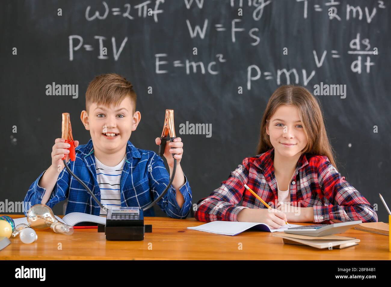Cute little children at physics lesson in classroom Stock Photo - Alamy