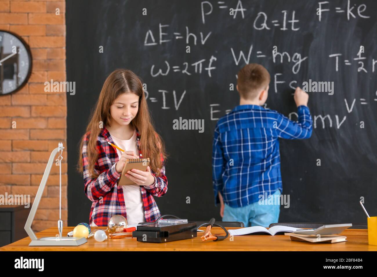 Cute little children at physics lesson in classroom Stock Photo - Alamy