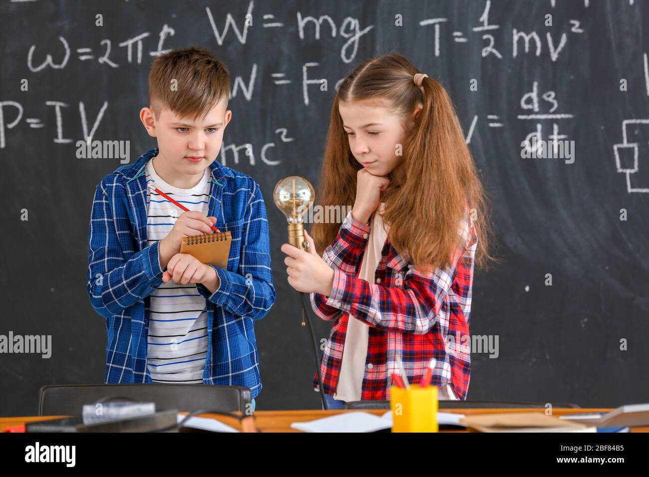Cute little children at physics lesson in classroom Stock Photo - Alamy