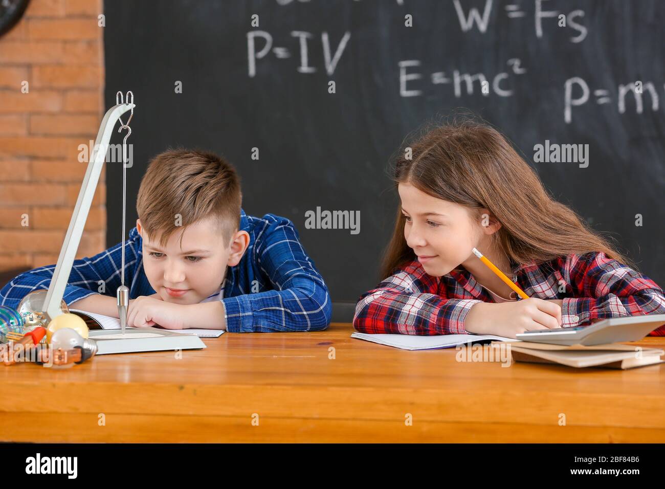 Cute little children at physics lesson in classroom Stock Photo - Alamy