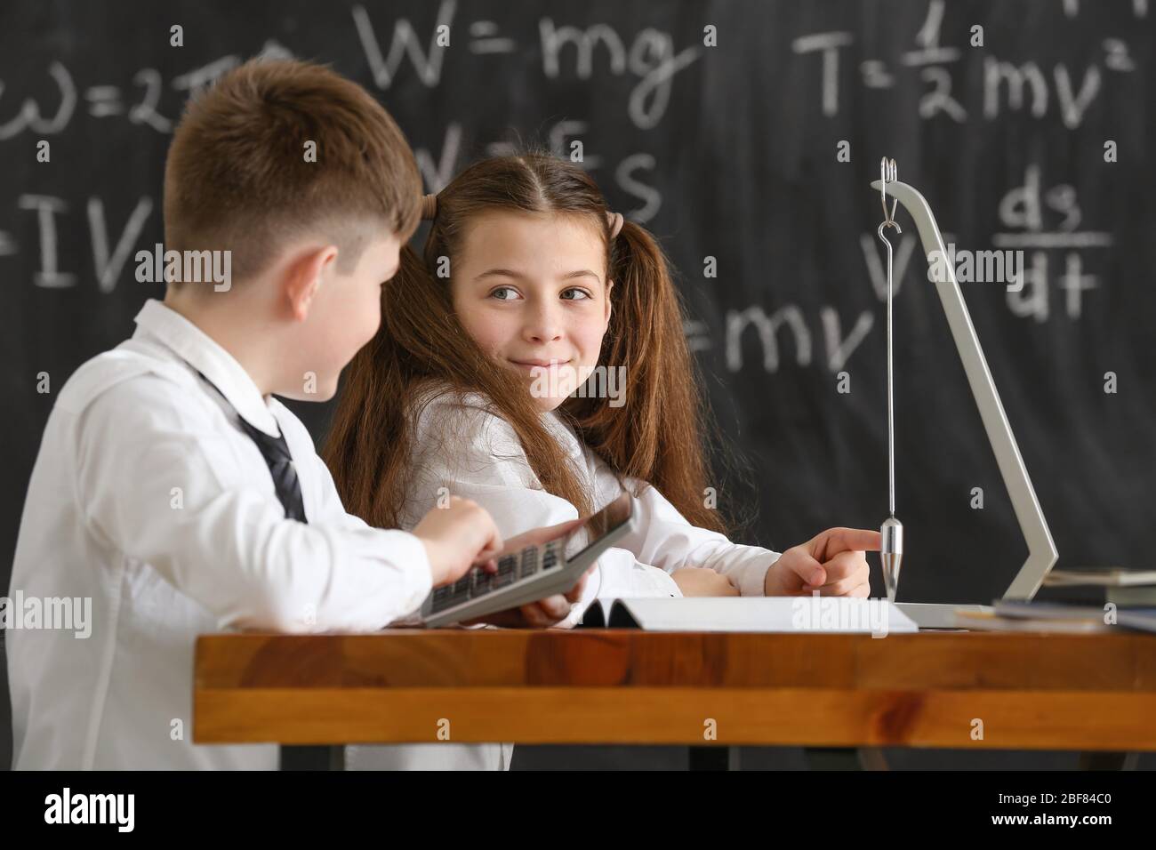 Cute little children at physics lesson in classroom Stock Photo - Alamy