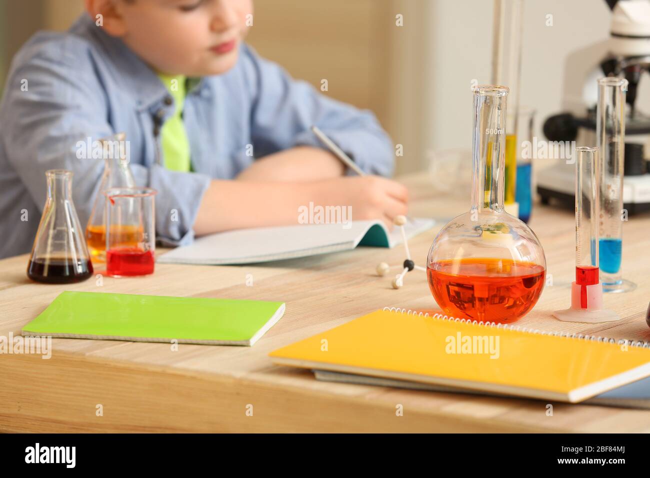 Laboratory glassware on table in classroom Stock Photo - Alamy