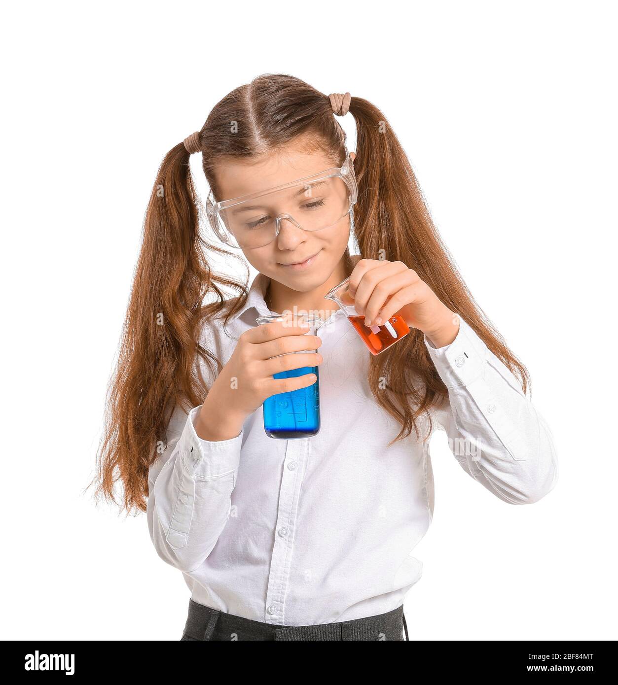 Cute little girl with laboratory glassware on white background Stock ...