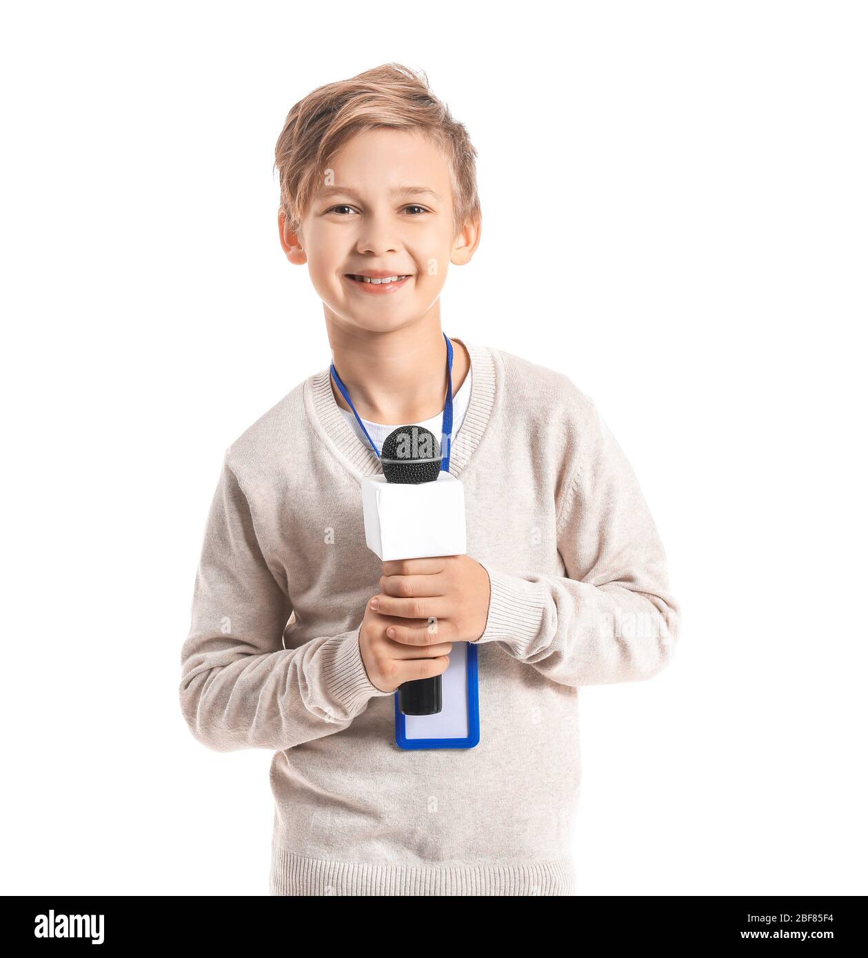 Little journalist with microphone on white background Stock Photo - Alamy