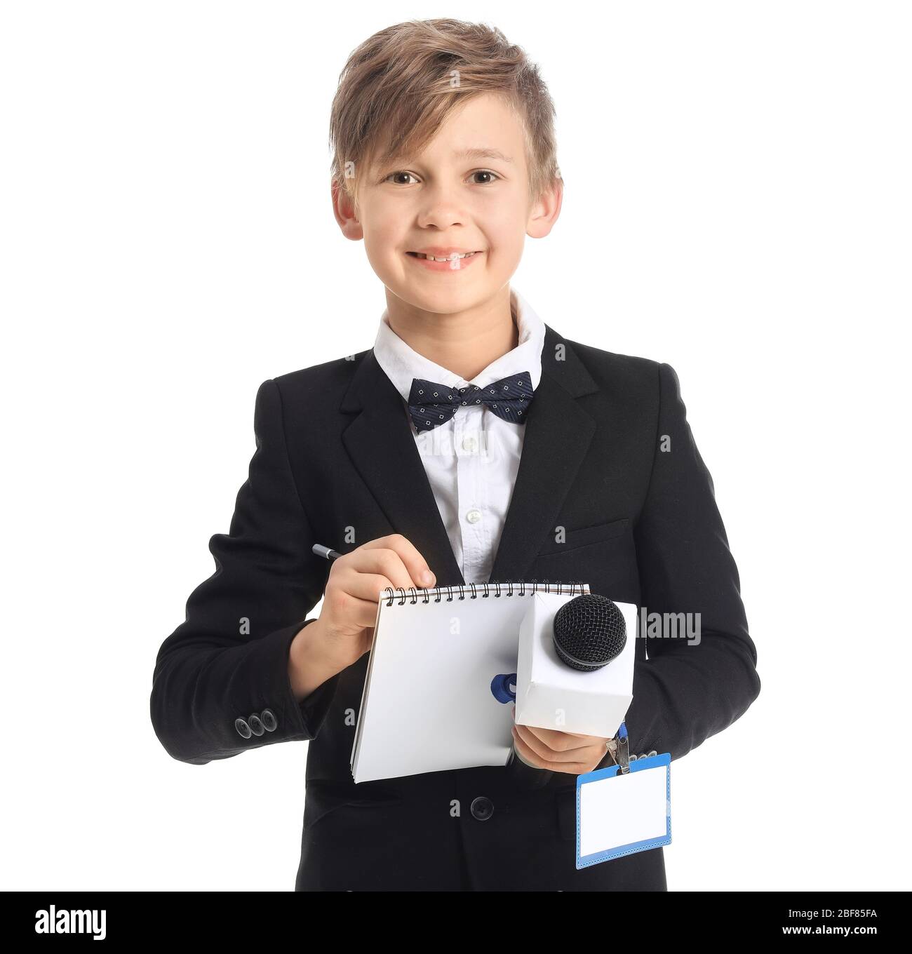 Little journalist with microphone and notebook on white background ...