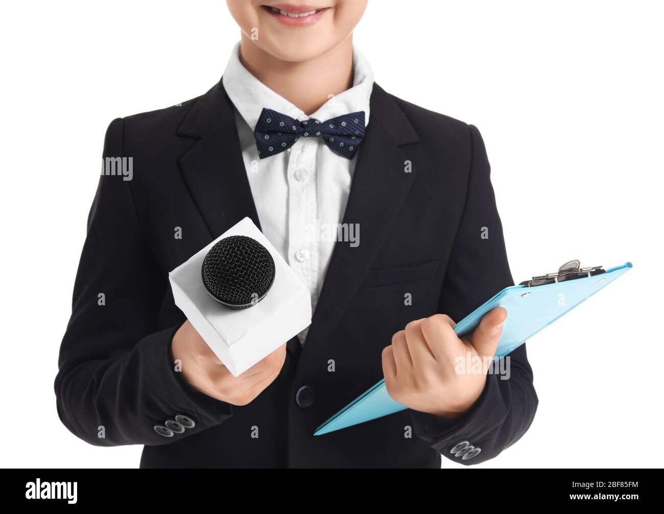 Little journalist with microphone on white background Stock Photo - Alamy