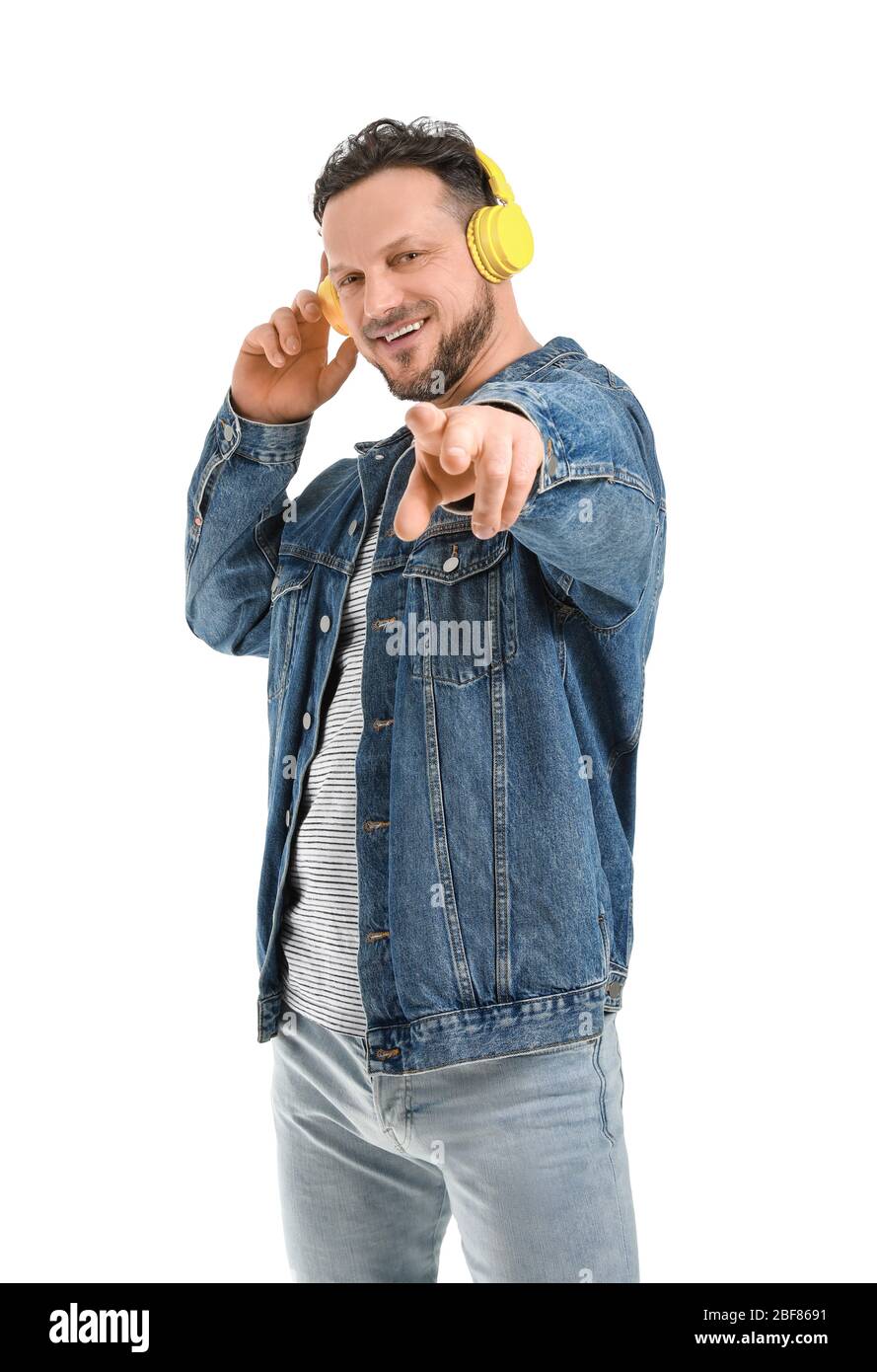 Stylish man listening to music on white background Stock Photo - Alamy