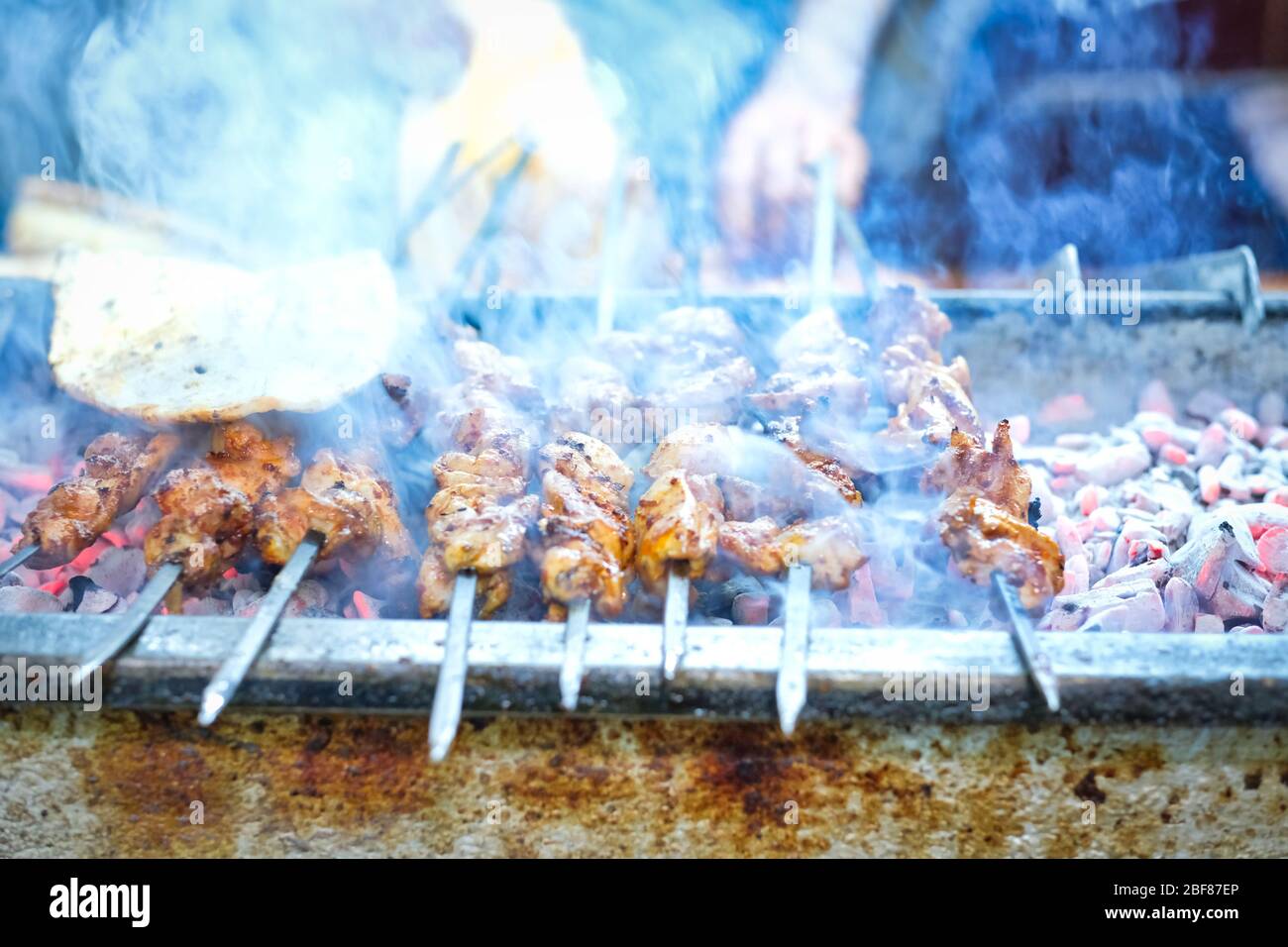 Kebab or kebap on metal skewer barbecue in the kebap restaurant ...