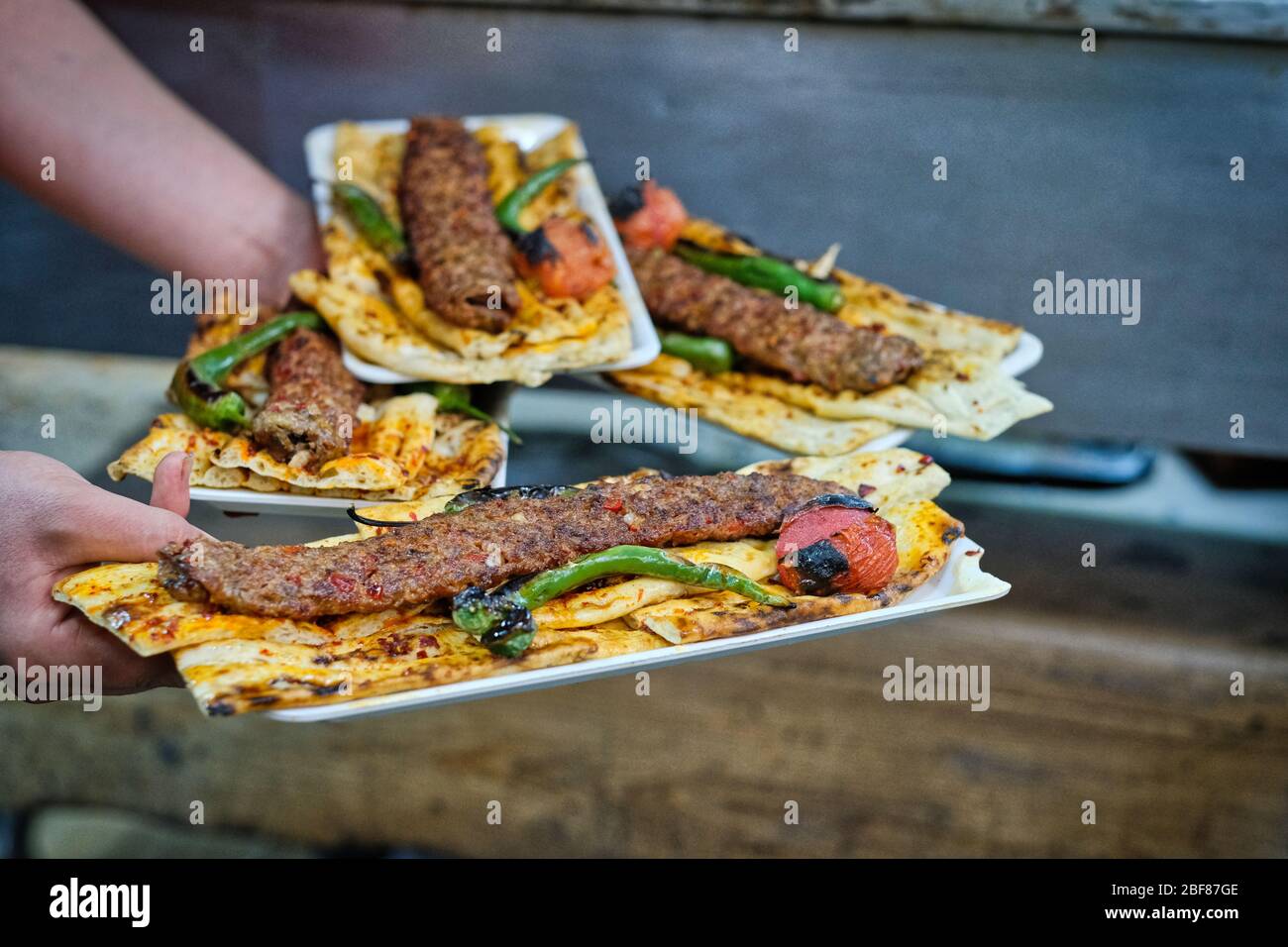 Kebab or kebap on metal skewer barbecue in the kebap restaurant ...