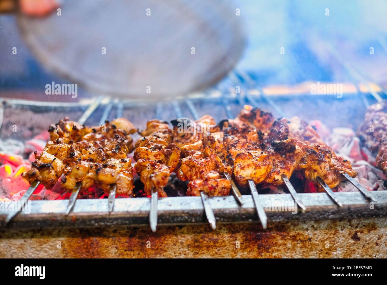Kebab or kebap on metal skewer barbecue in the kebap restaurant ...