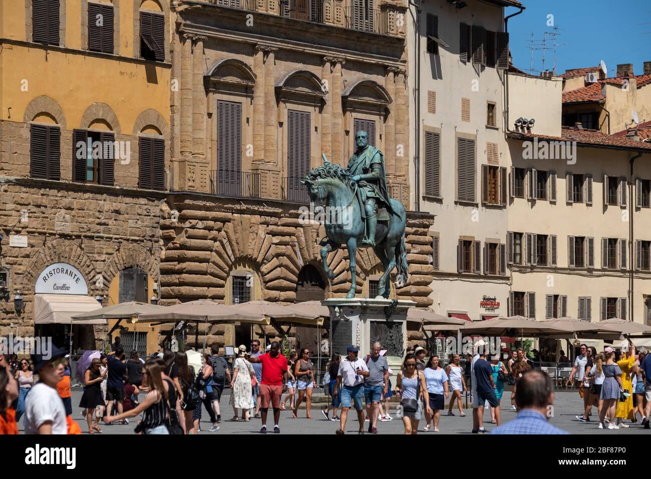 Tourists visiting the most famous attractions and monuments in old city ...