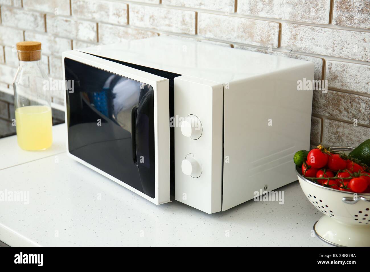 Modern microwave oven in kitchen Stock Photo - Alamy