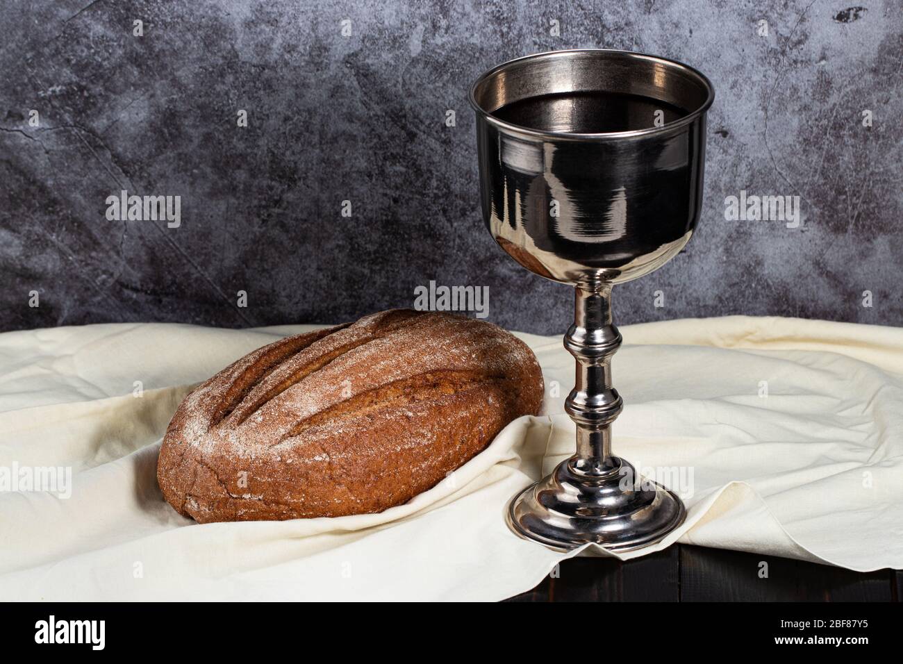 holy communion chalice with wine and bread Stock Photo - Alamy