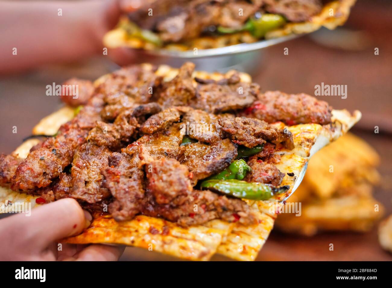 Kebab or kebap on metal skewer barbecue in the kebap restaurant ...