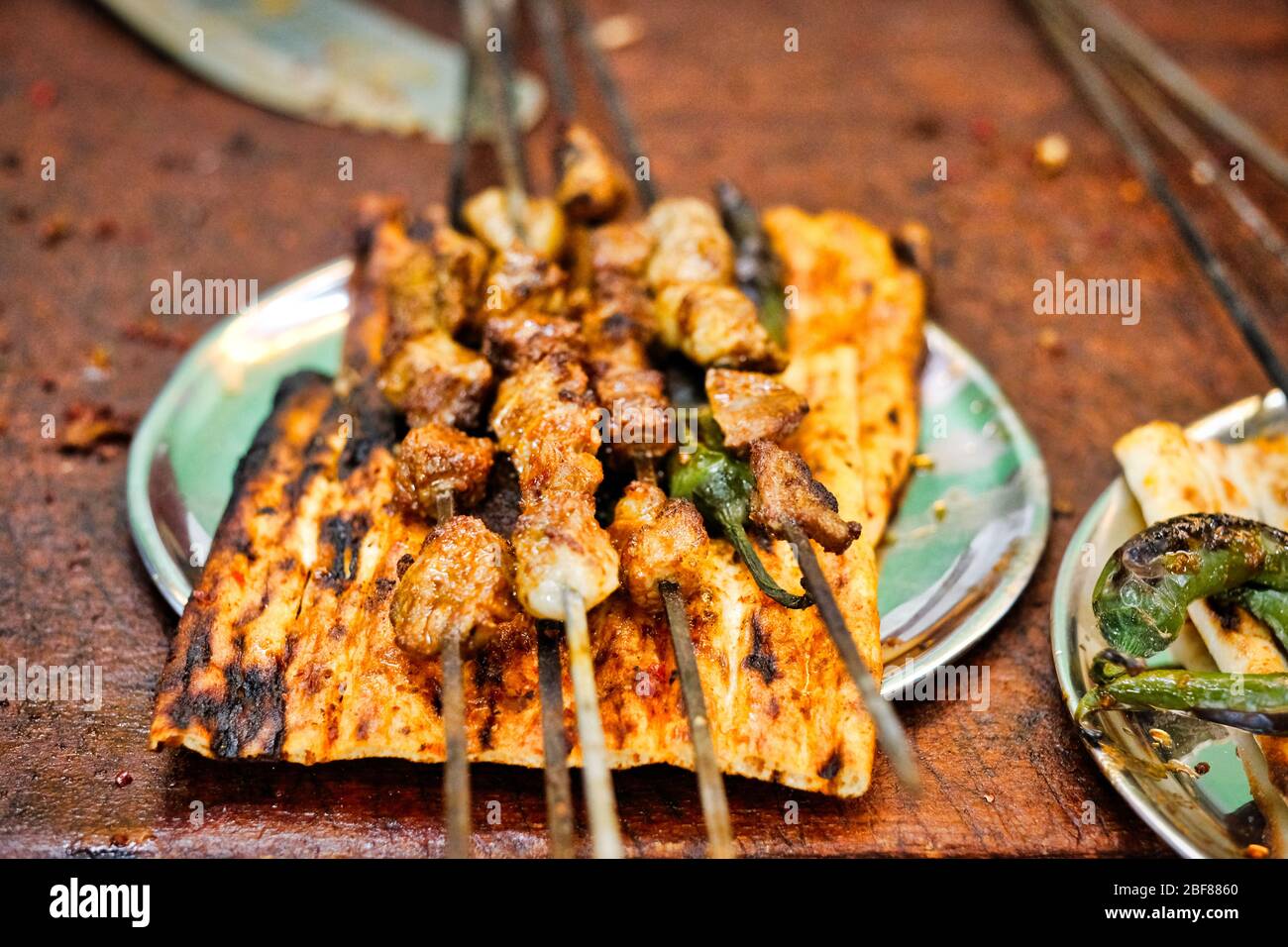 Kebab or kebap on metal skewer barbecue in the kebap restaurant ...