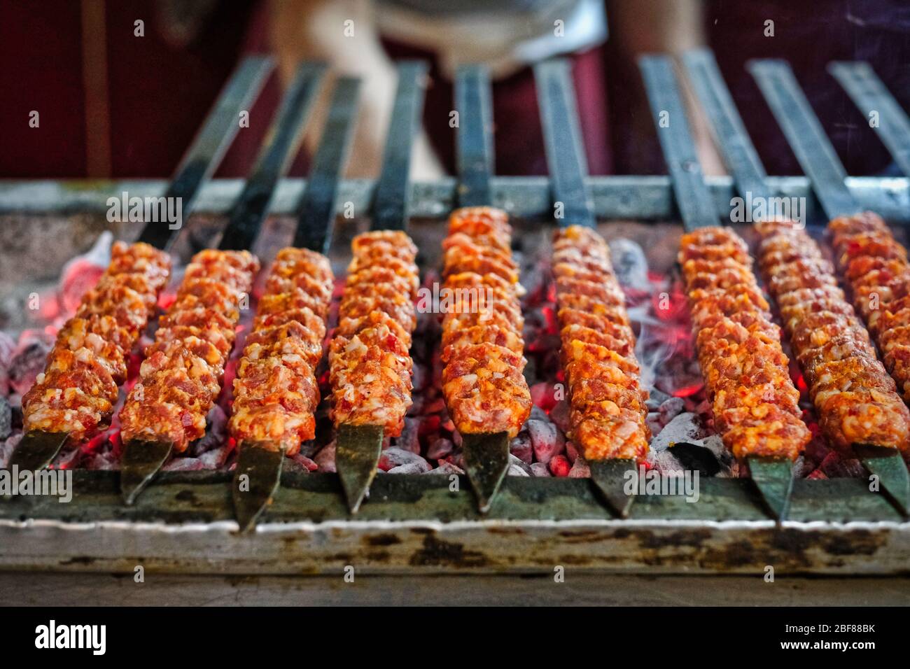 Kebab or kebap on metal skewer barbecue in the kebap restaurant ...