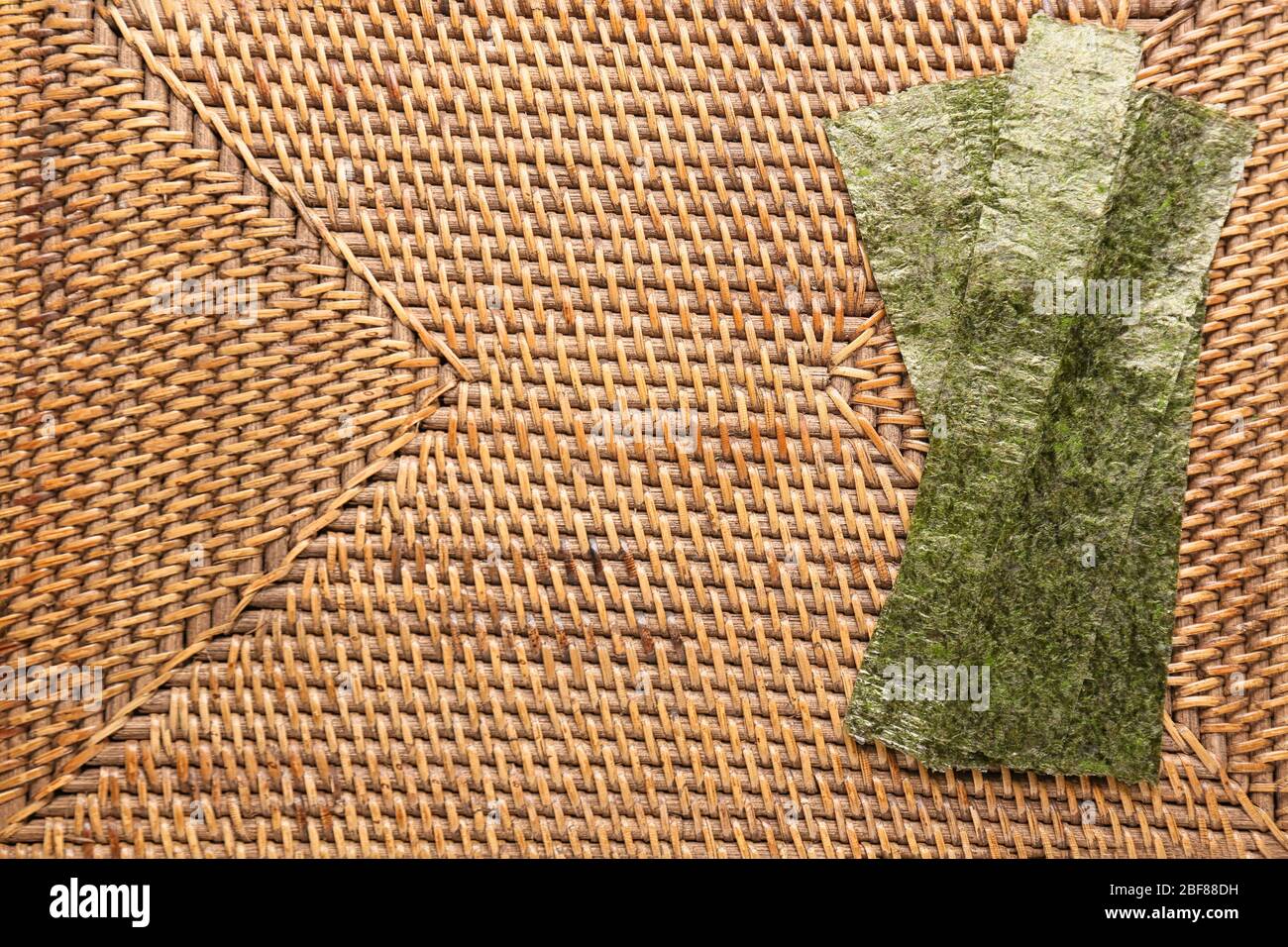 Tasty seaweed sheets on wicker mat Stock Photo - Alamy