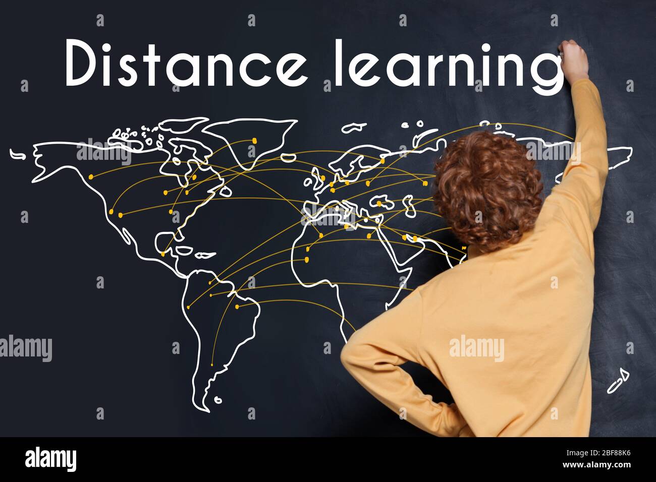 Distance learning concept. School boy and word map on blackboard ...