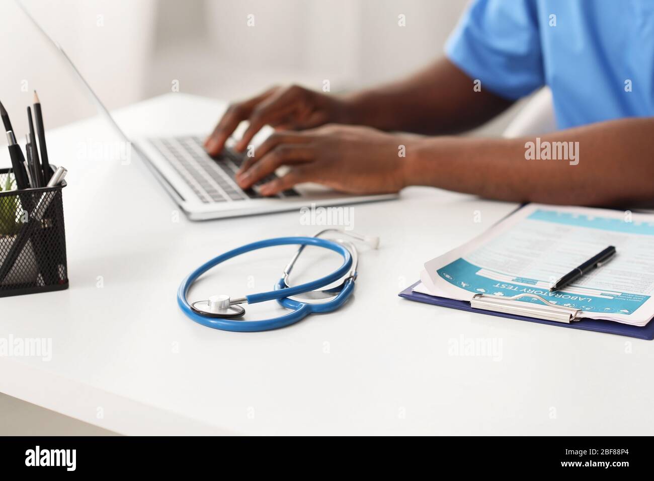Stethoscope on doctor's table in clinic Stock Photo - Alamy
