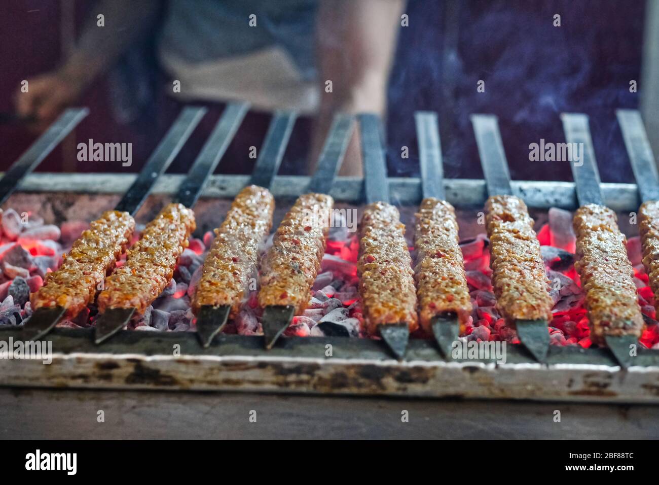 Kebab or kebap on metal skewer barbecue in the kebap restaurant ...