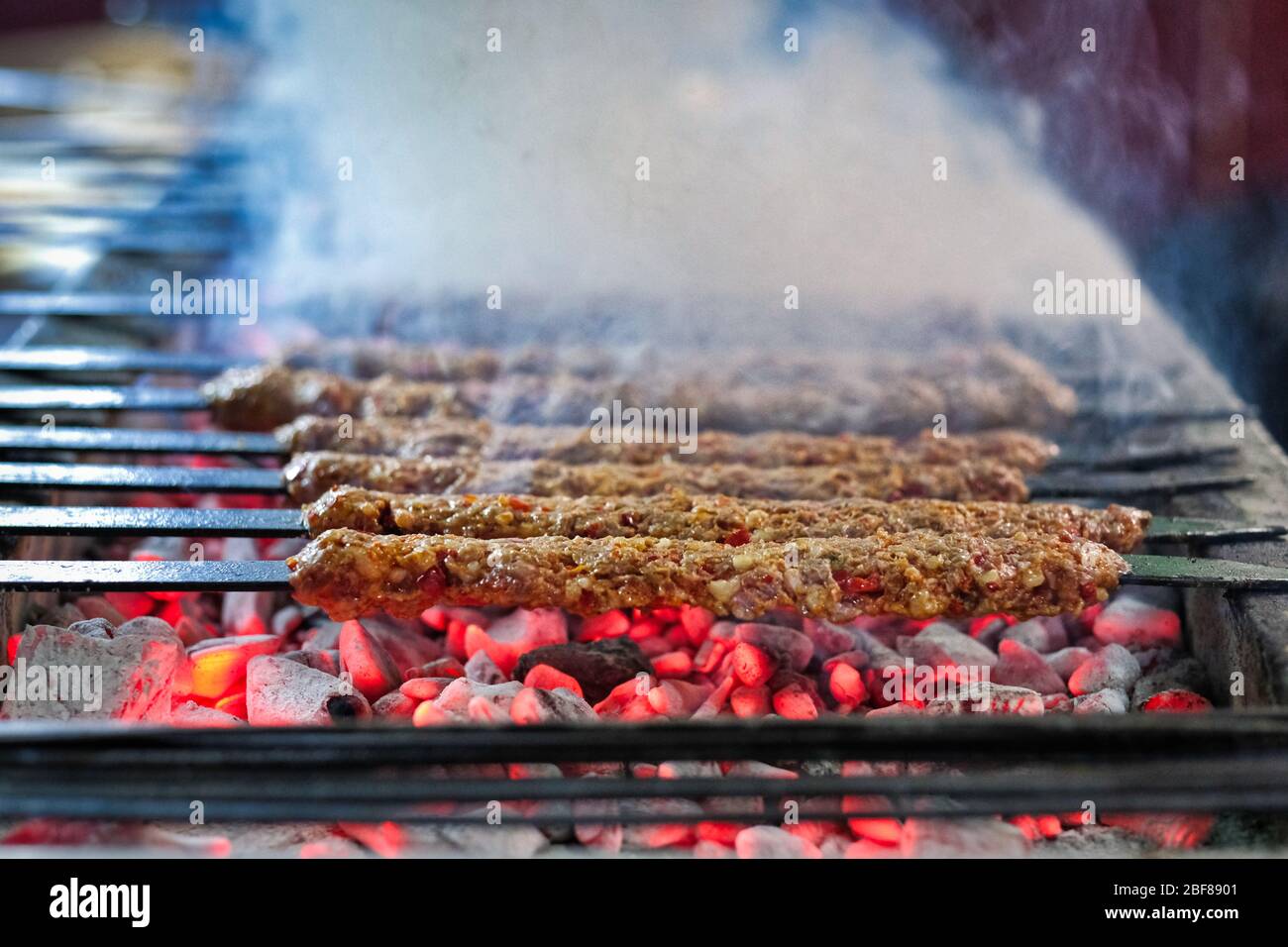 Kebab or kebap on metal skewer barbecue in the kebap restaurant ...