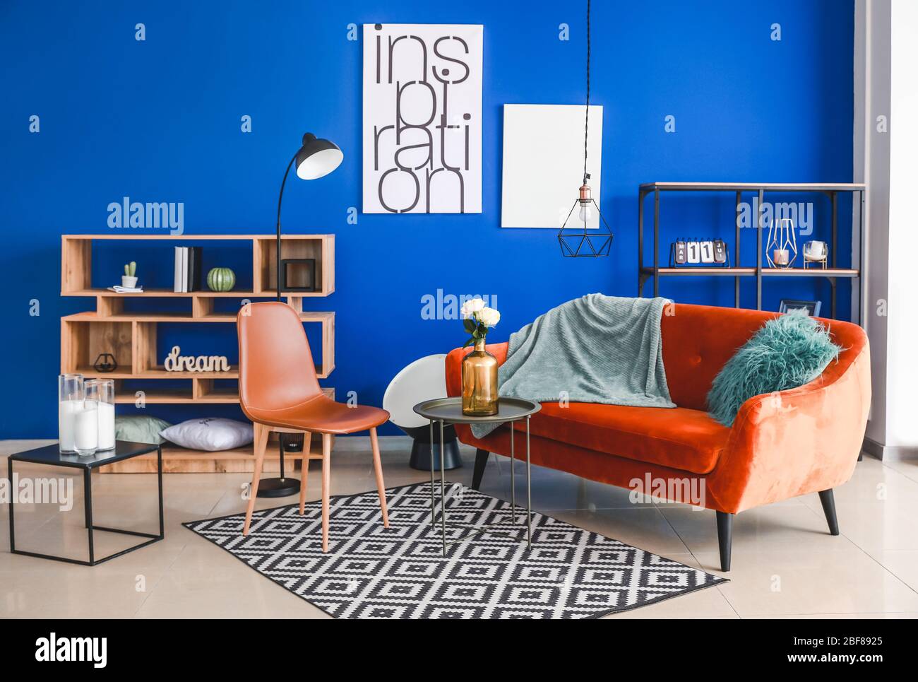 Interior of modern living room with blue wall Stock Photo - Alamy