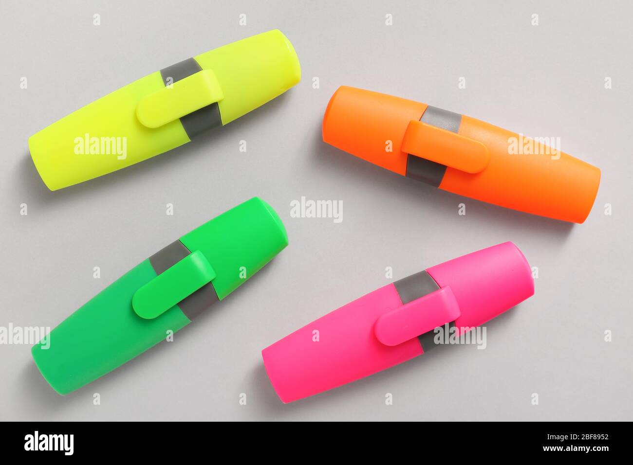Set of markers on grey background Stock Photo - Alamy