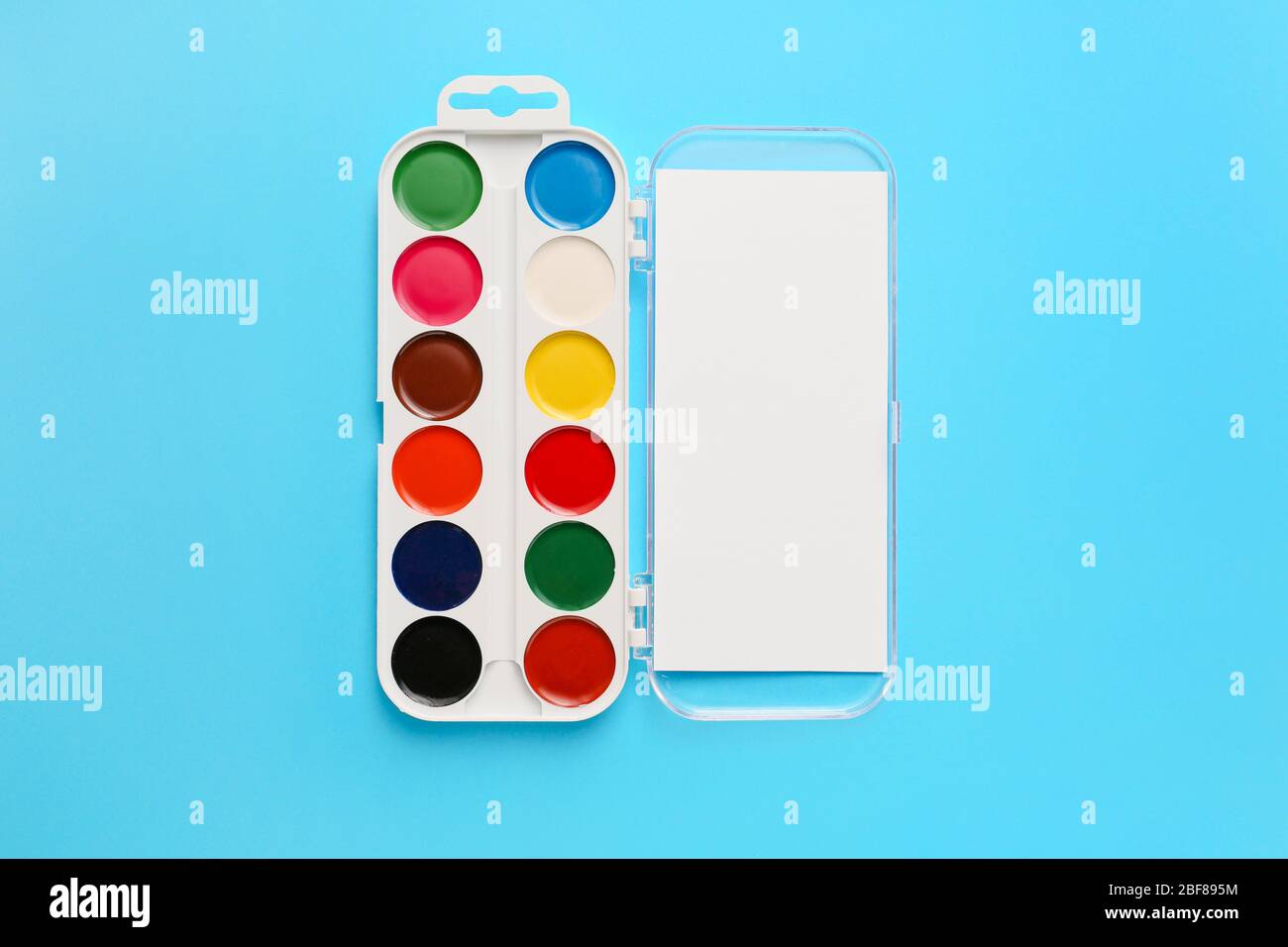 Palette of paints on color background Stock Photo - Alamy