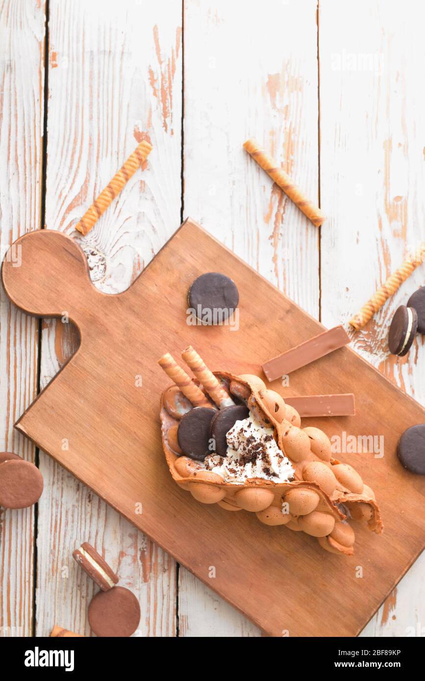 Delicious sweet bubble waffle on table Stock Photo - Alamy