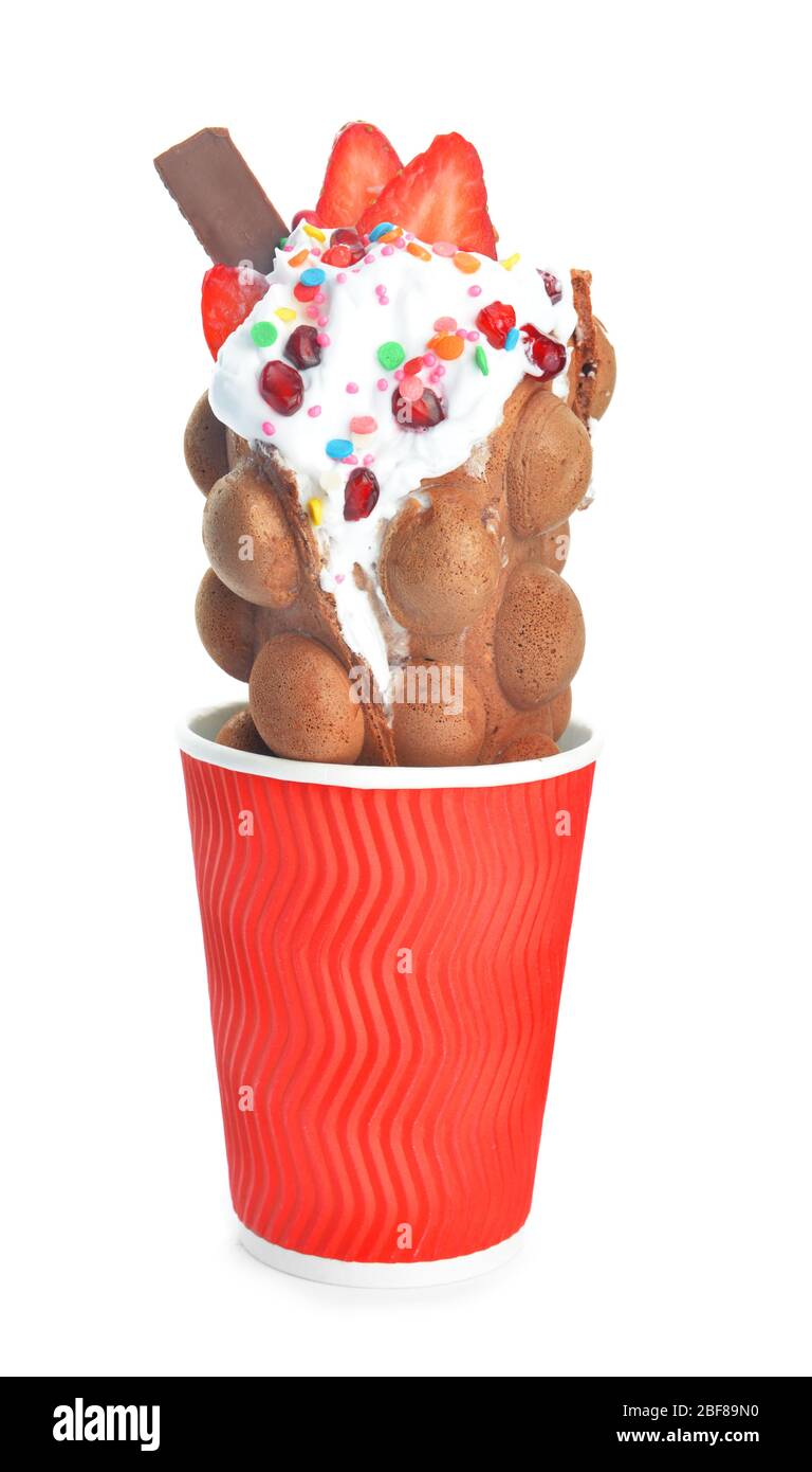 Delicious sweet bubble waffle in cup on white background Stock Photo ...