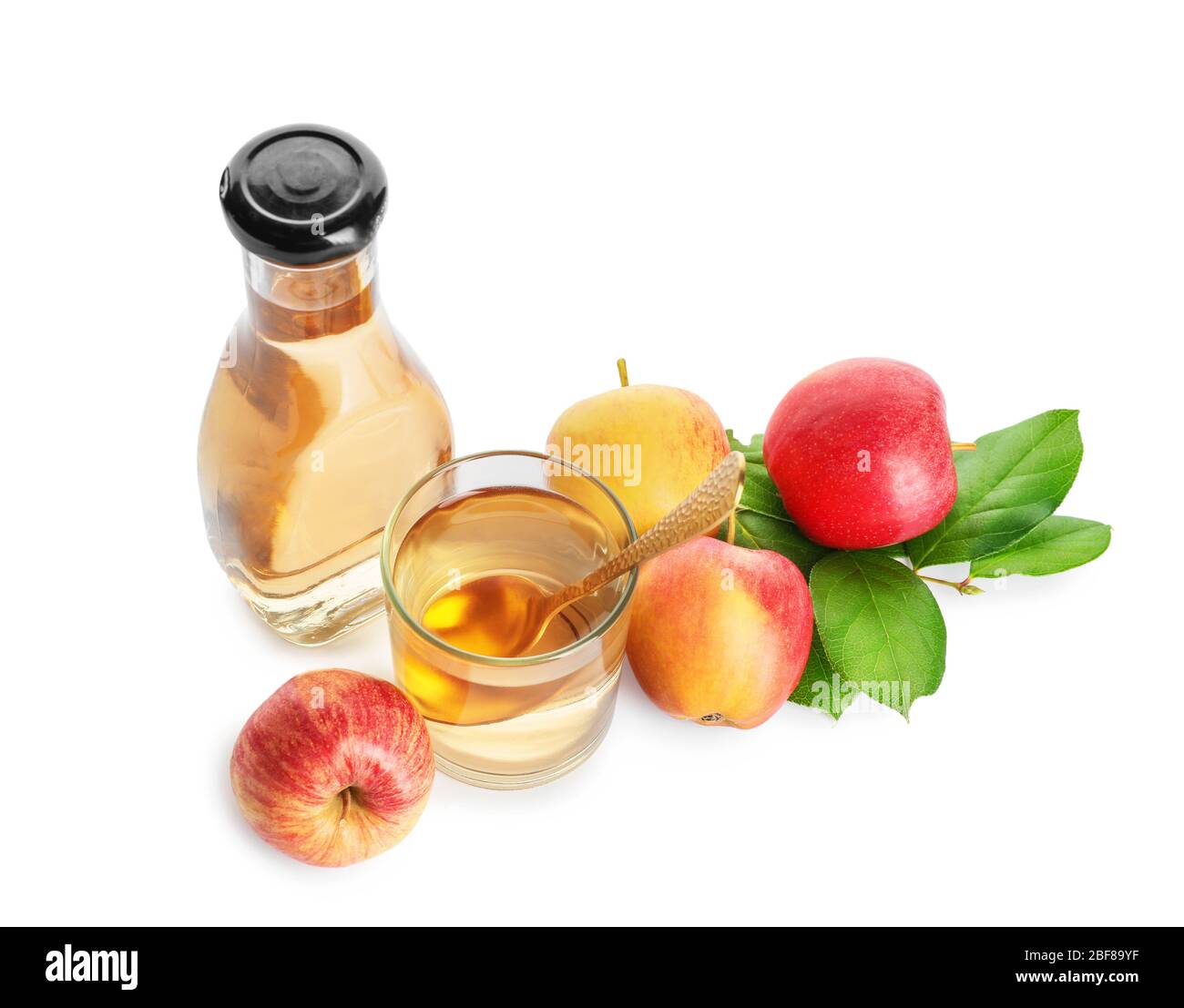 Apple cider vinegar on white background Stock Photo - Alamy