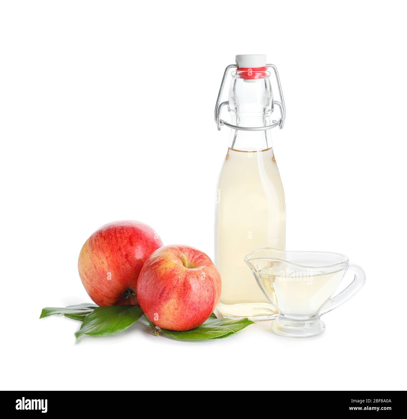 Apple cider vinegar on white background Stock Photo - Alamy