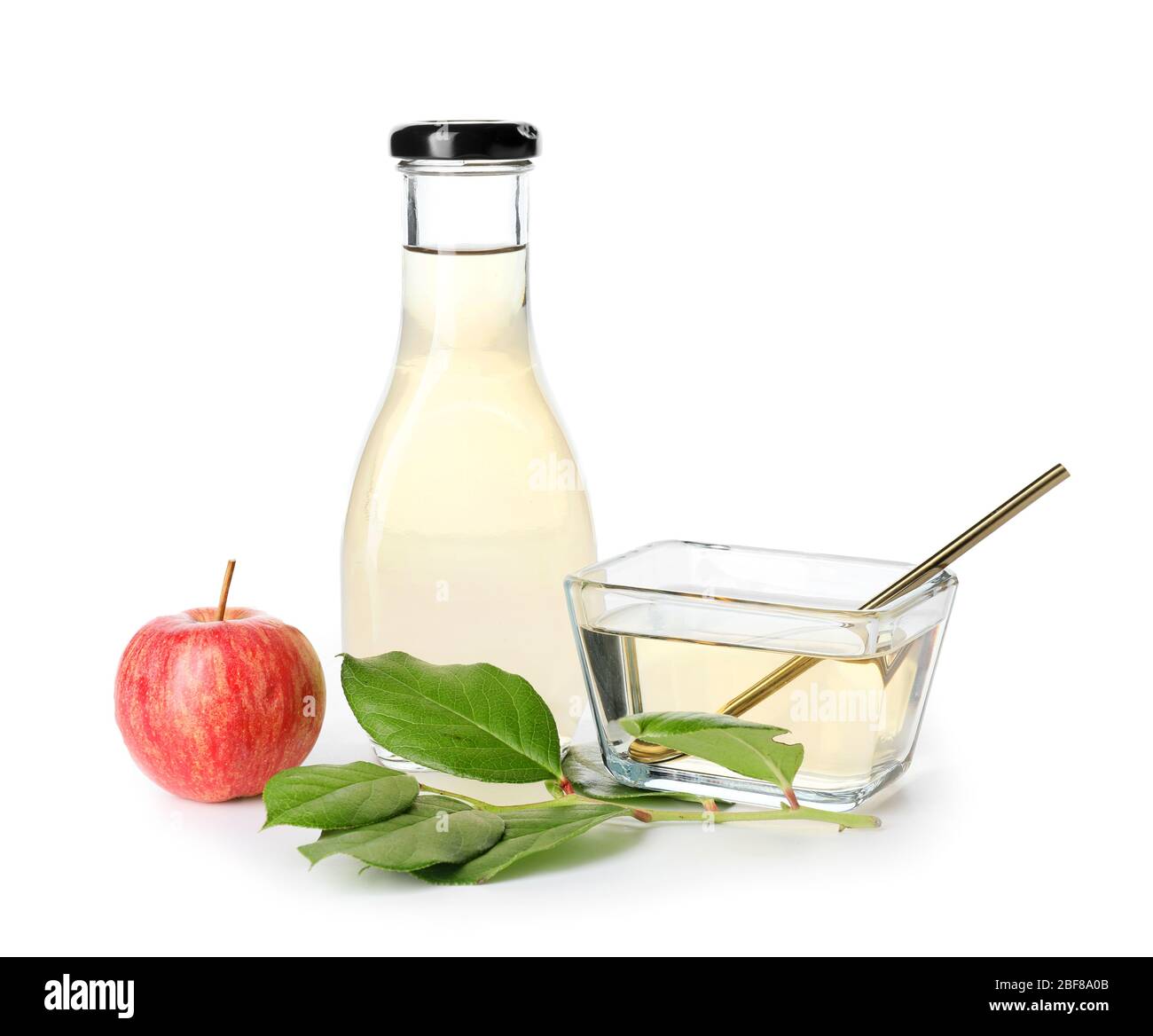 Apple cider vinegar on white background Stock Photo - Alamy